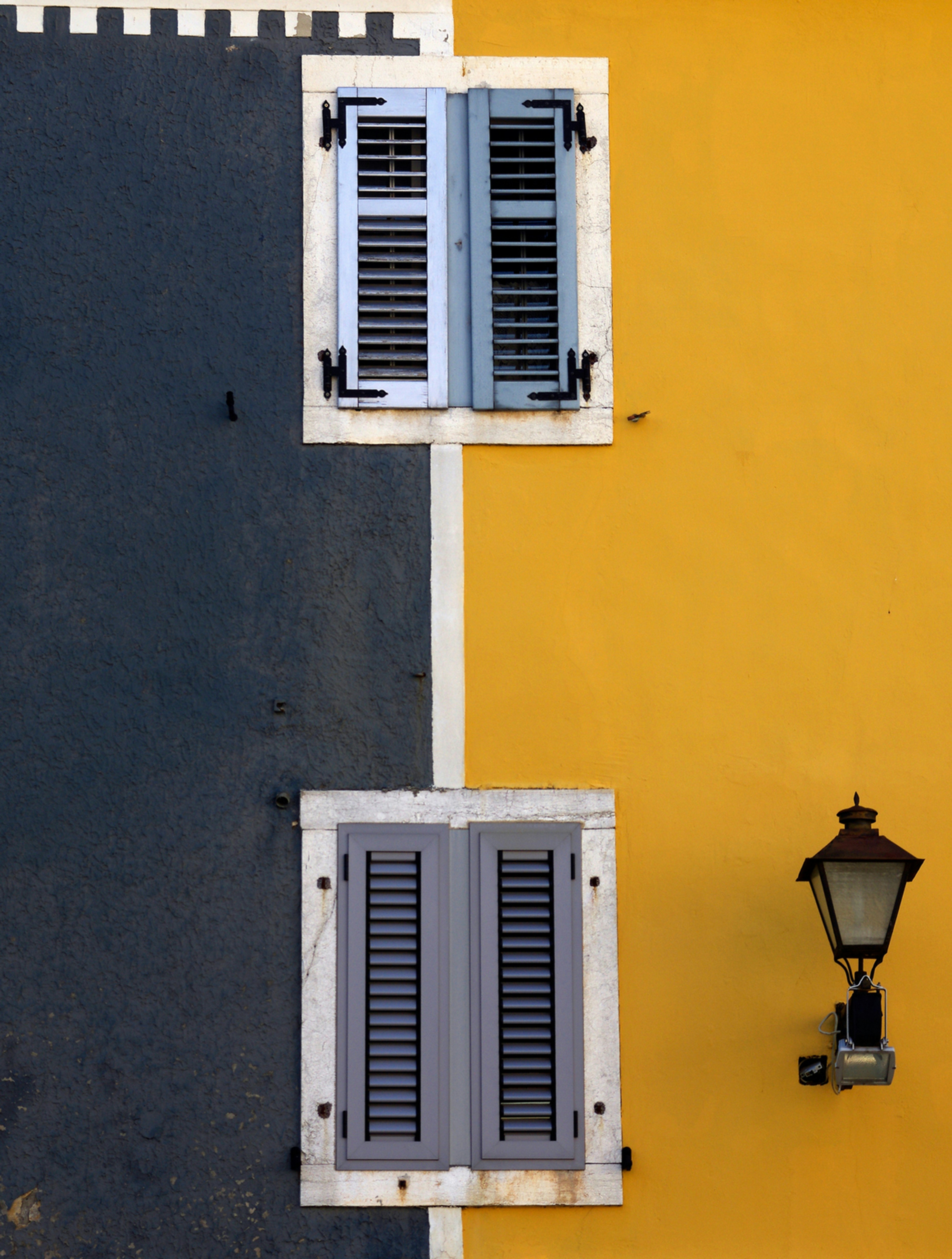 Split-Color Facade with Narrow Window Lines