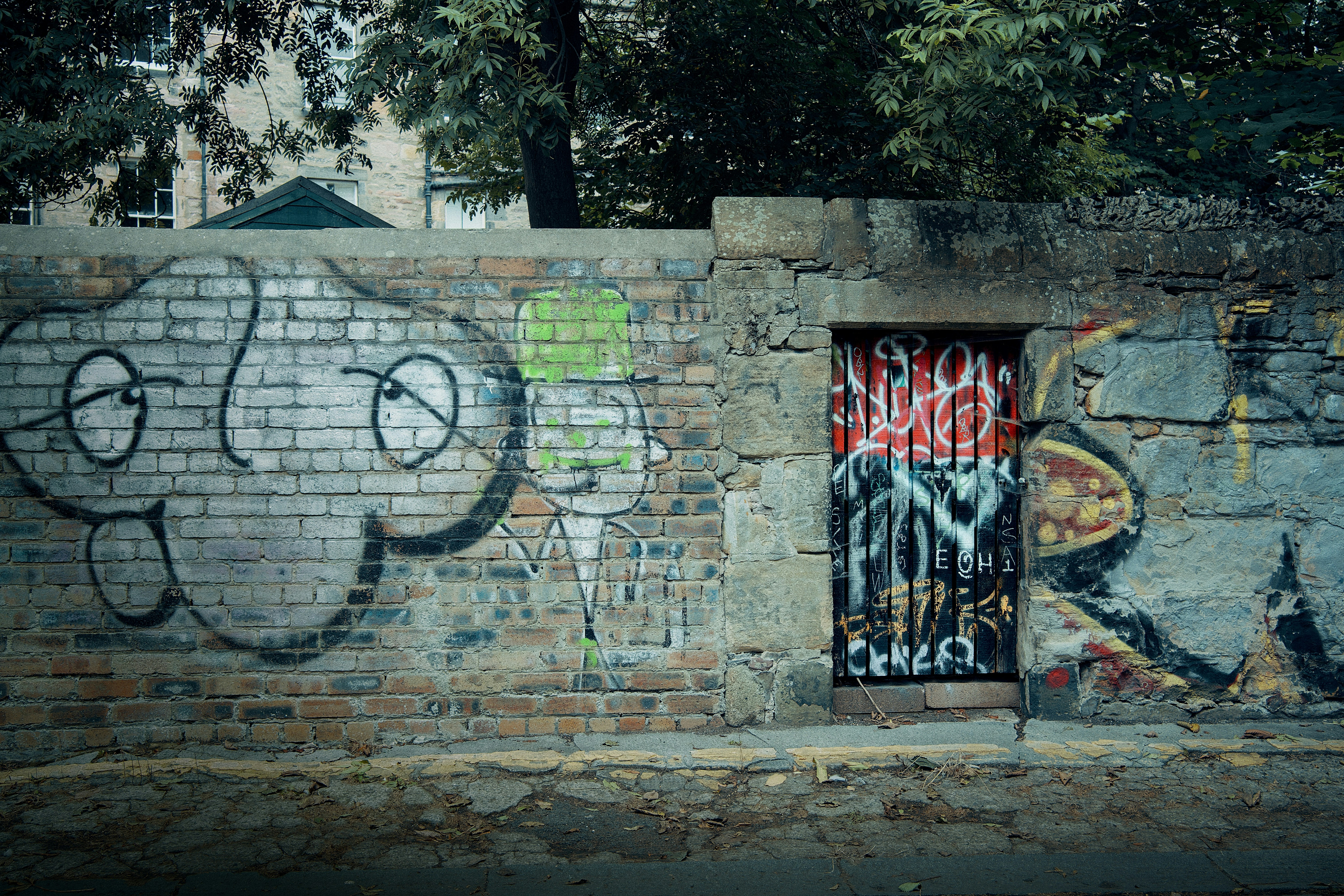 Graffiti Wall with Weathered Doorway as Quiet Centerpiece