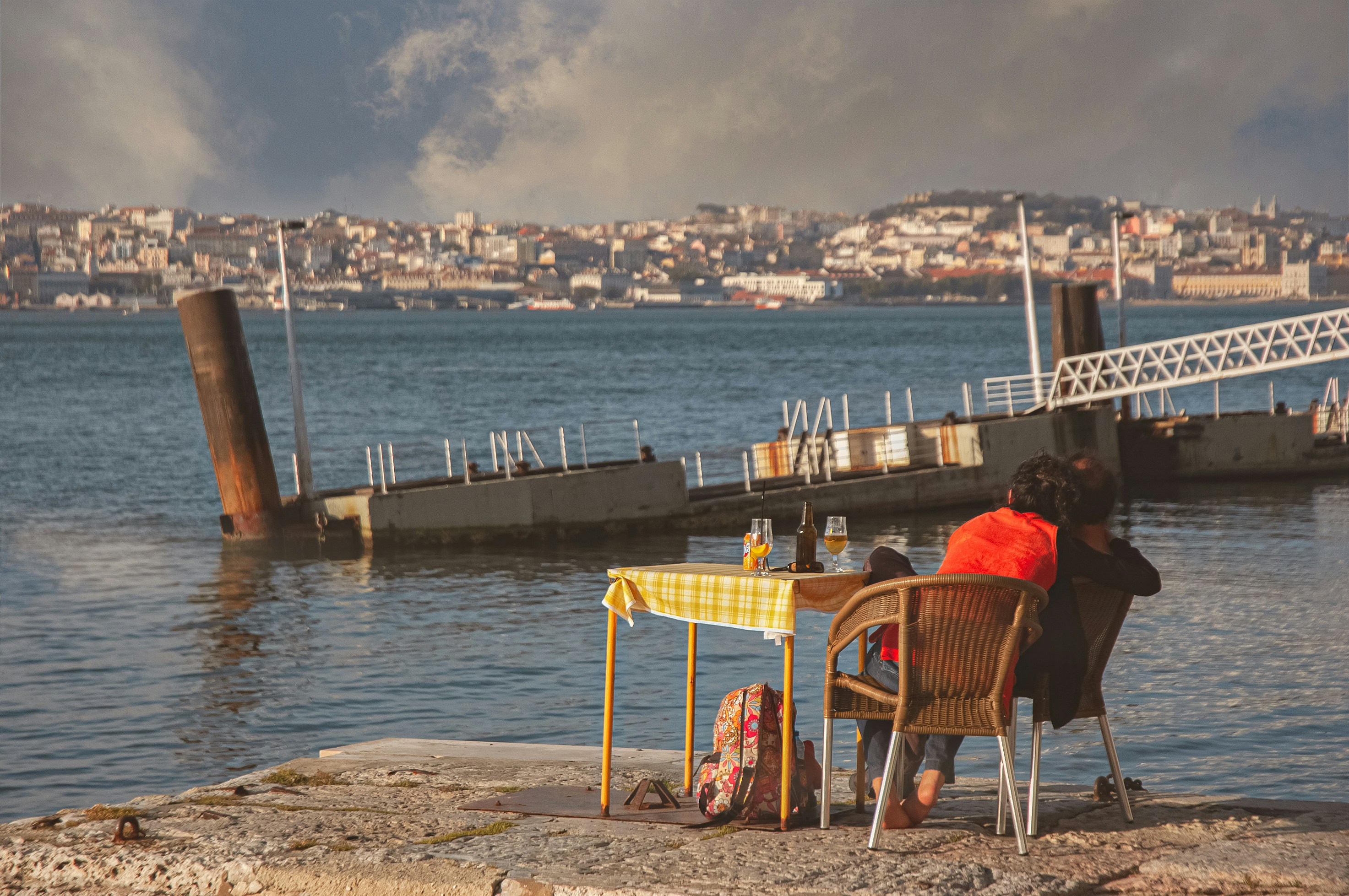 Beachside Table for Two: Quiet Afternoon by the Harbor