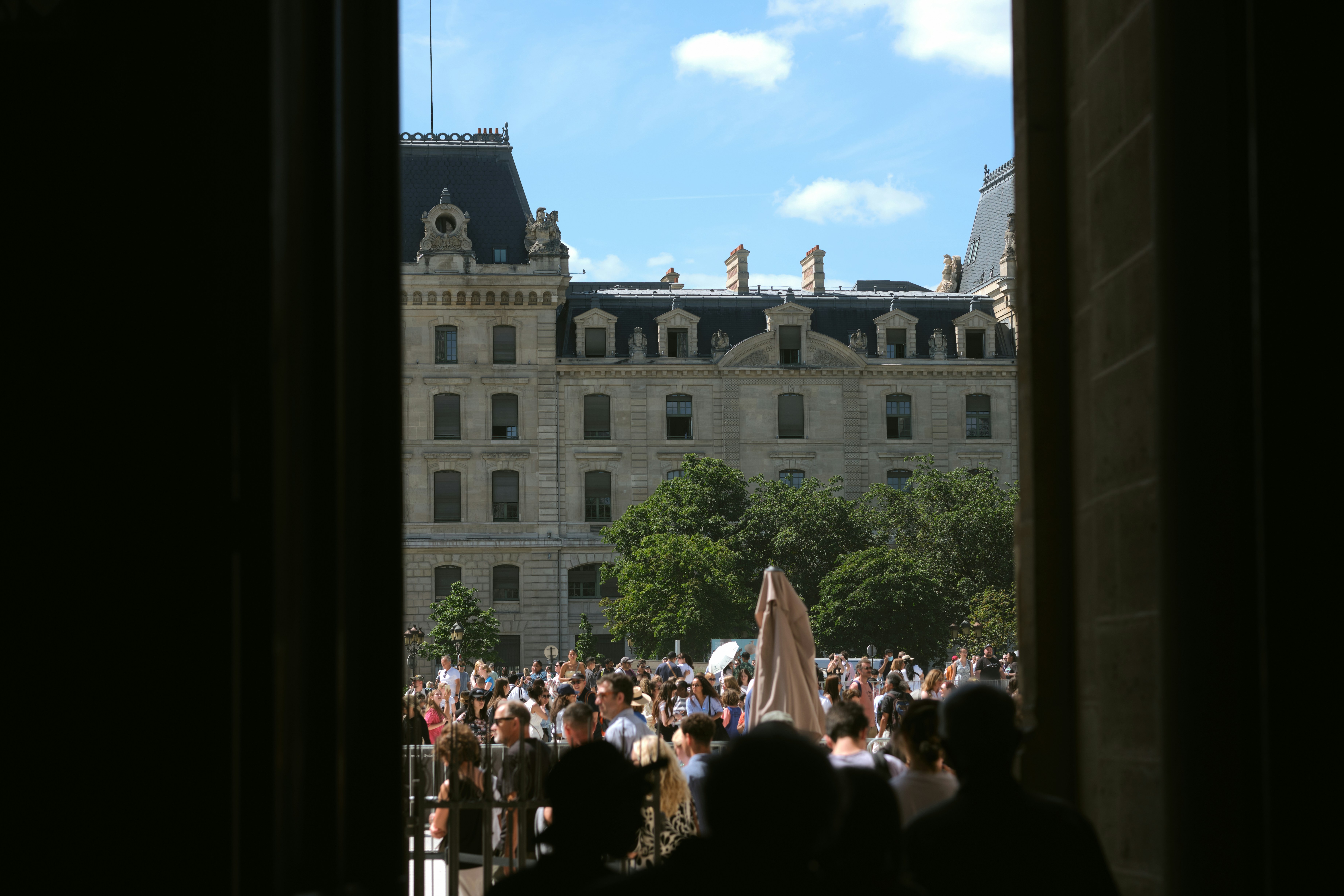 Gate to the Plaza: Sunlit Courtyard Framed by Shaded Arcades