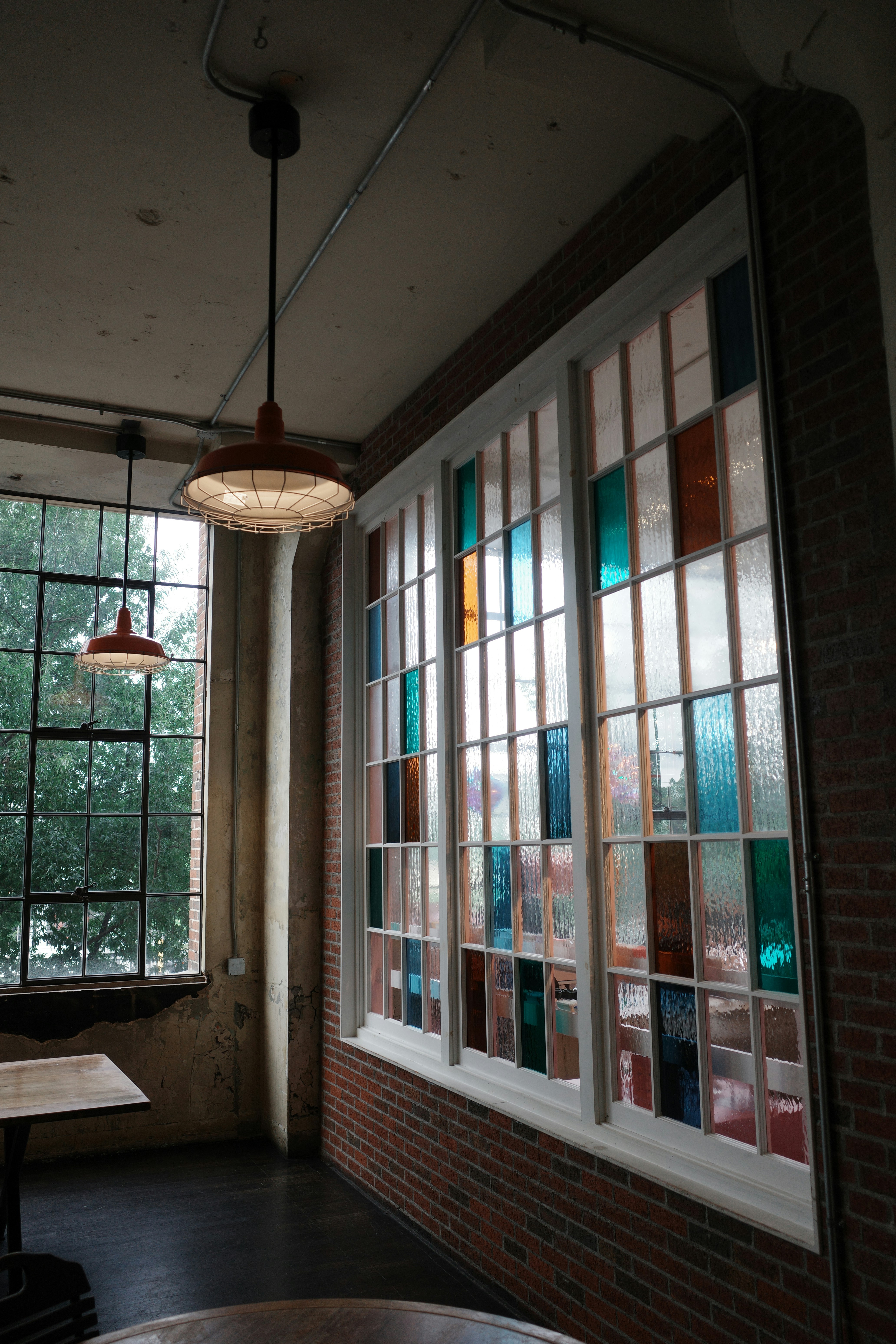 Industrial Sunlight Through Colored Windows in a Loft-like Studio