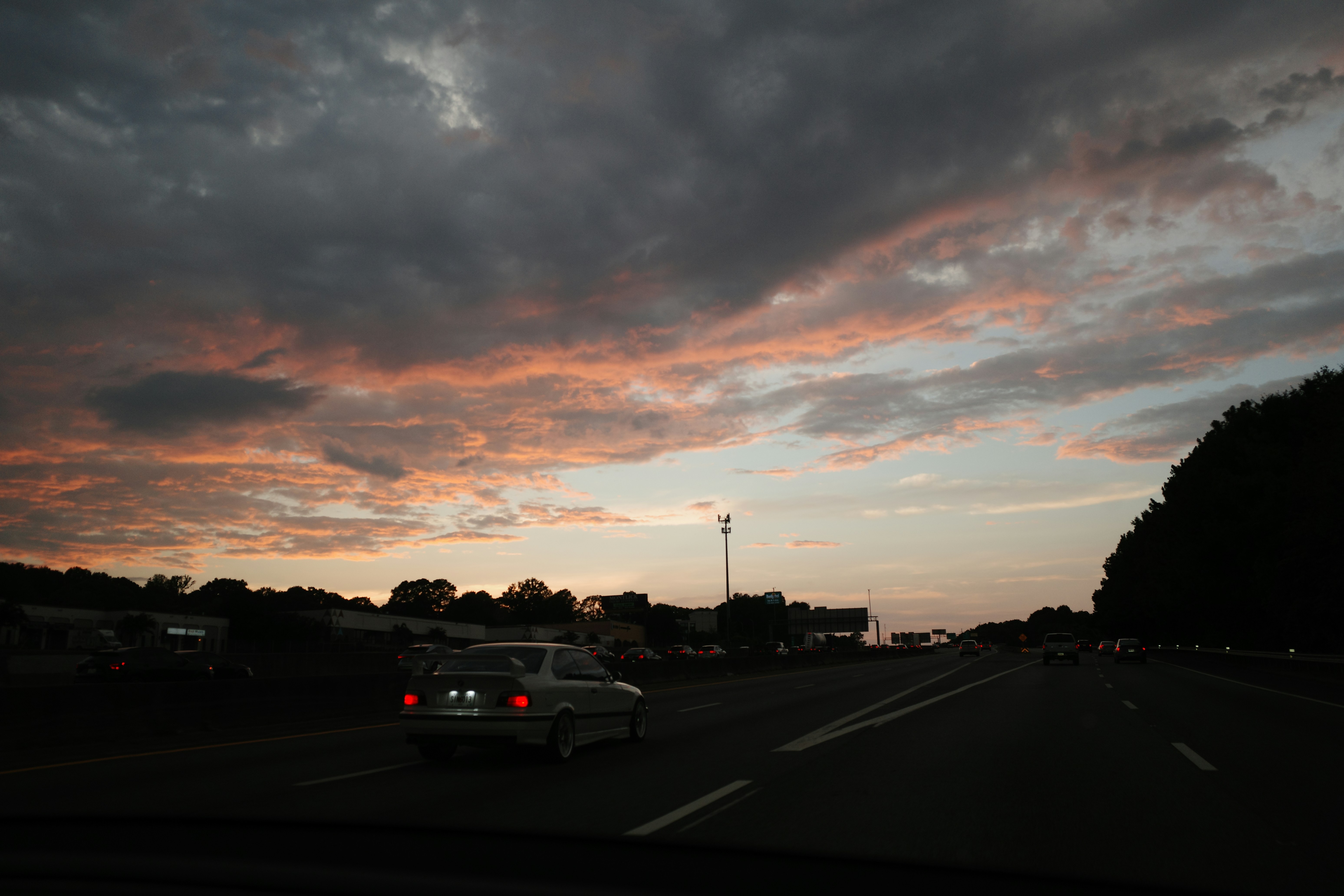 Sunset Horizon Over a Moving Highway