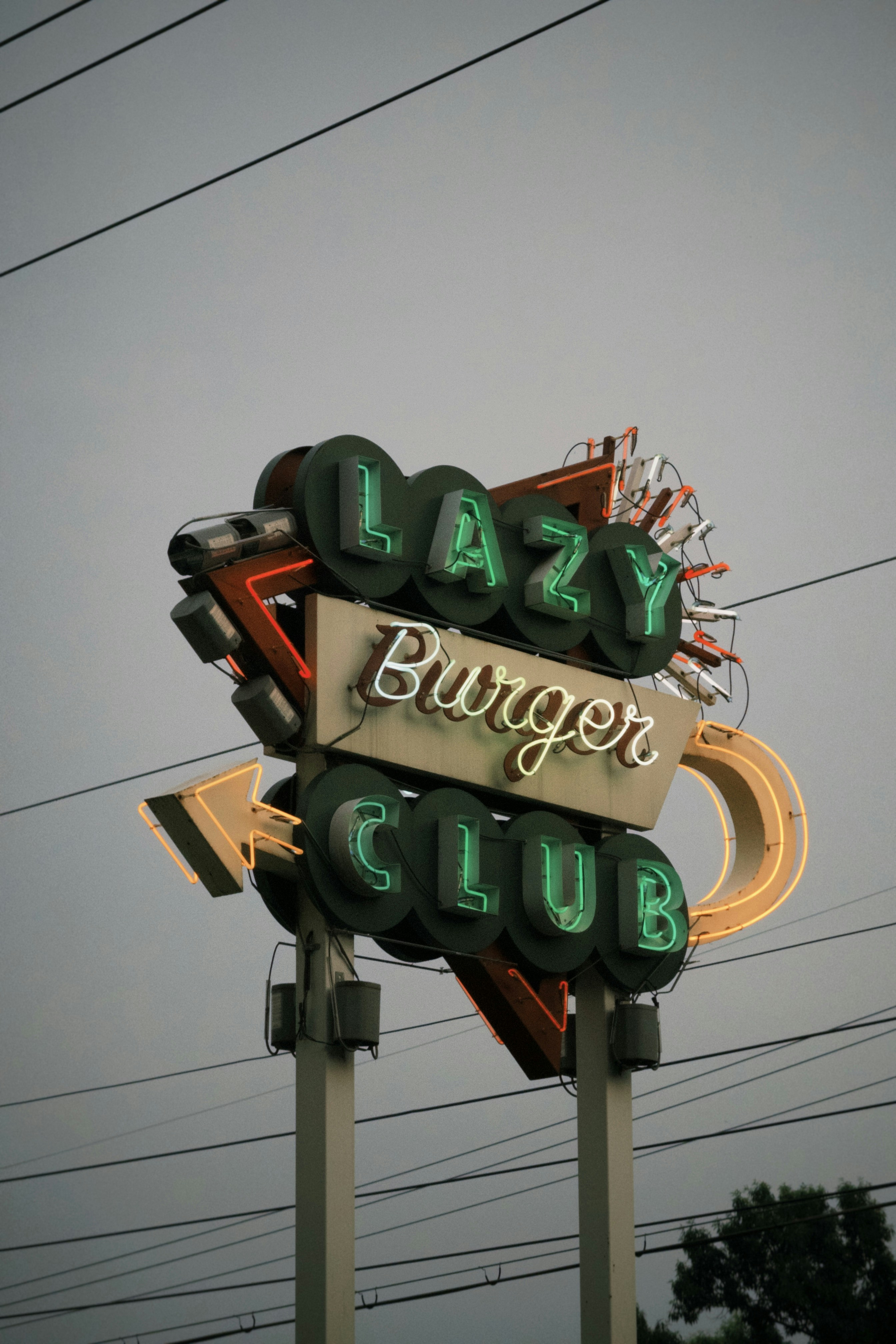 Neon Las Vegas Sign: Lazily Spinning Light Trio Over a Static Street