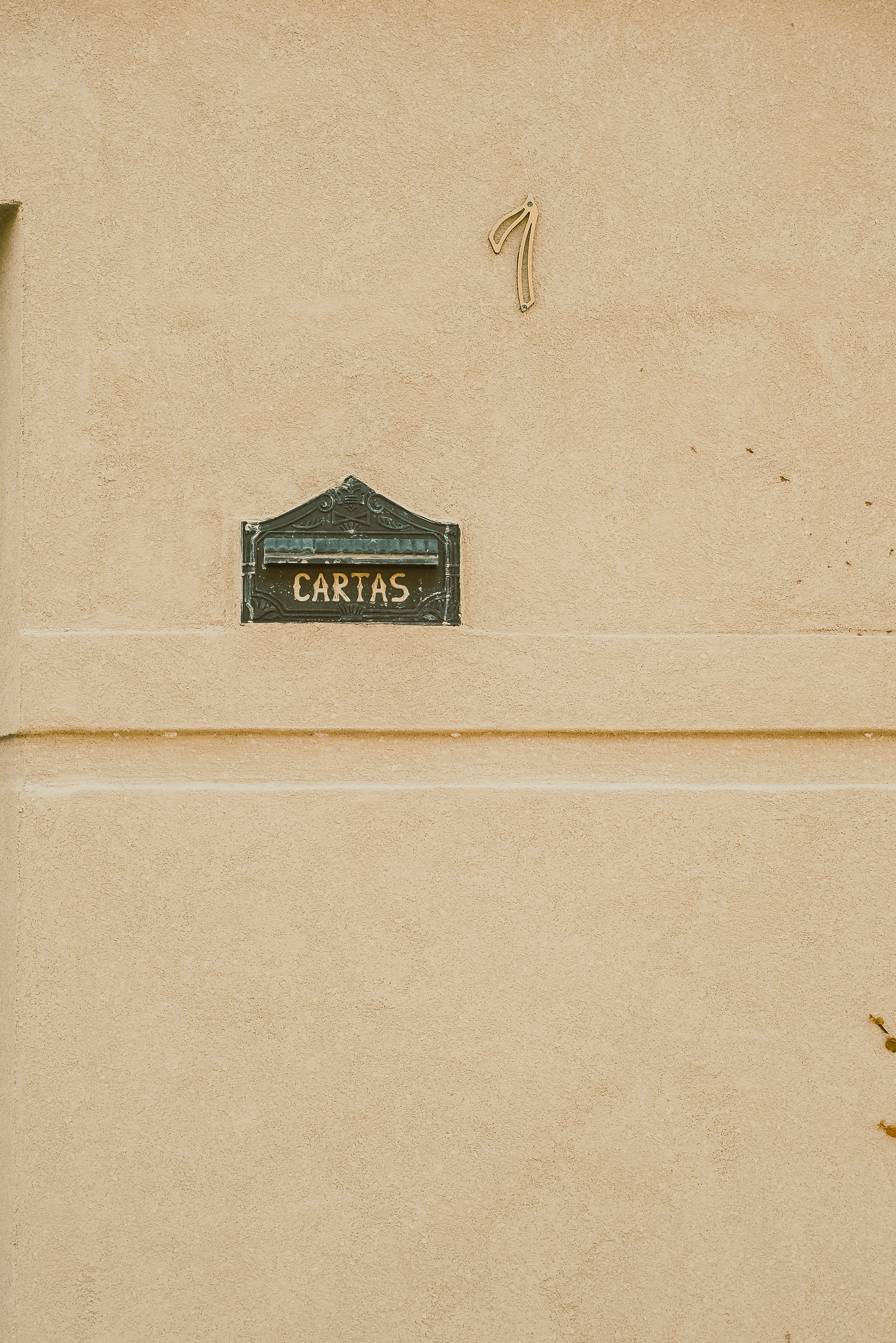 The Metal Sign: CARTAS on a Weathered Wall