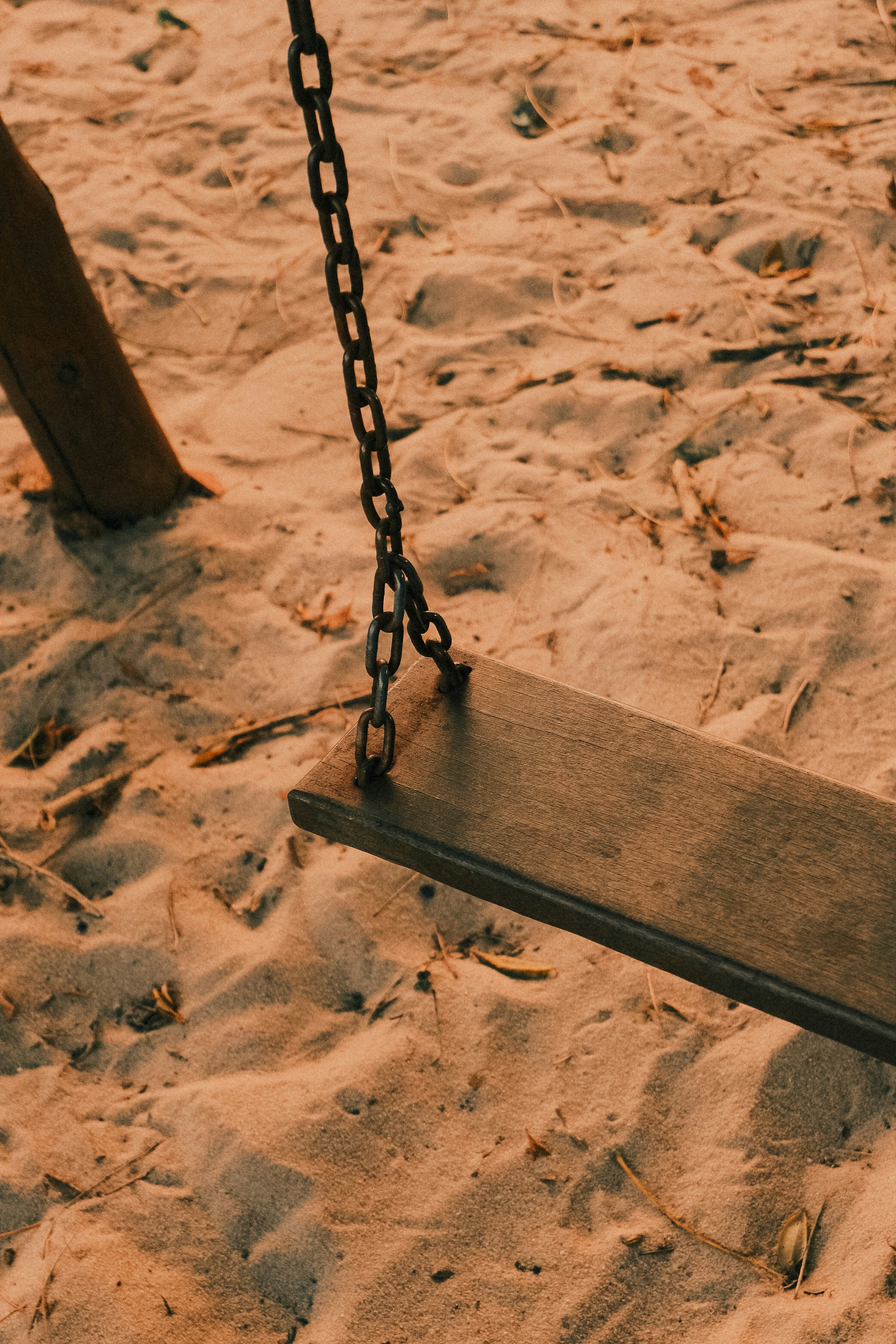 Swing in the Sand: Weathered Wood and Chain Echoes