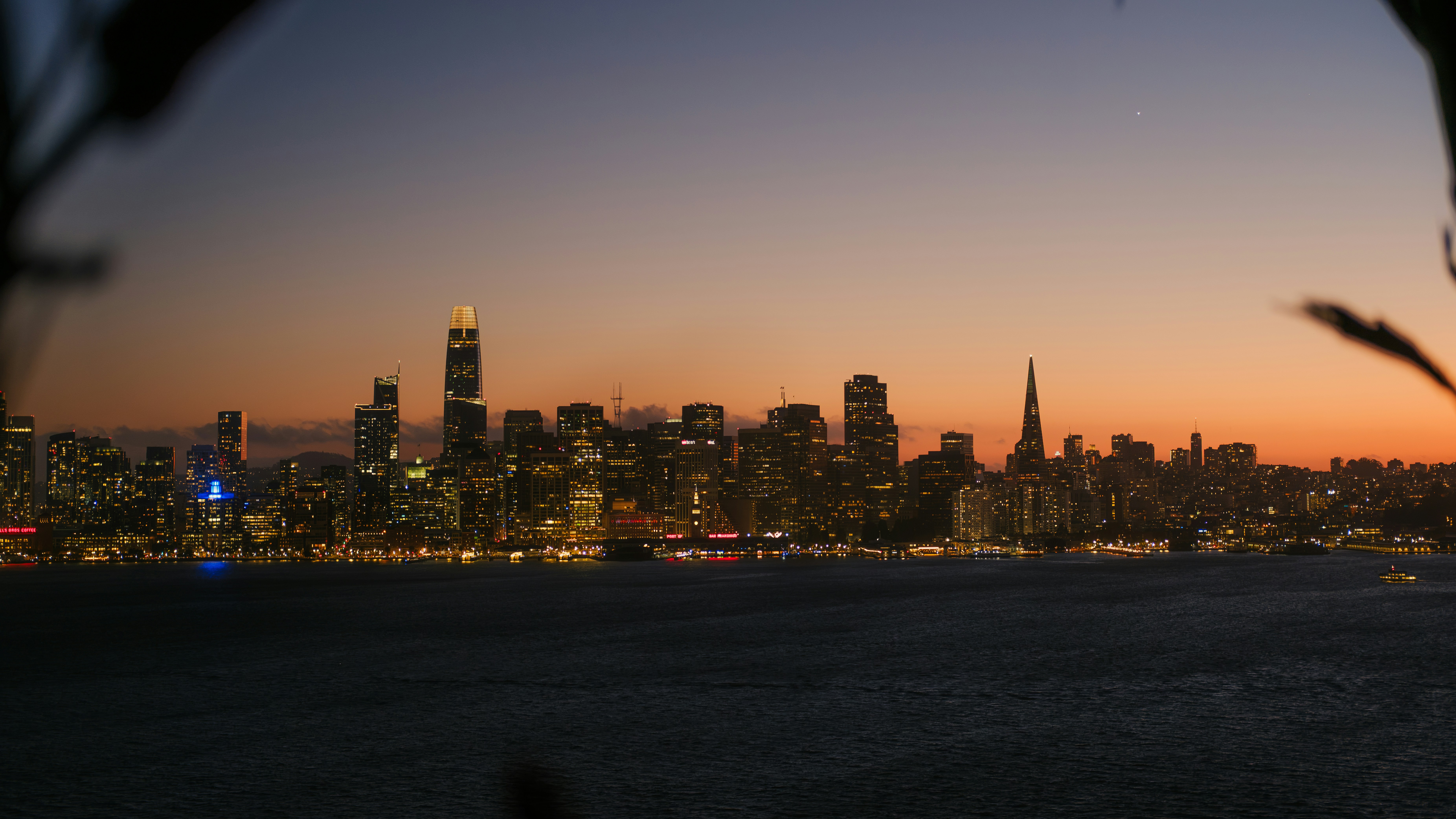  twilight skyline: city lights awaken along the water