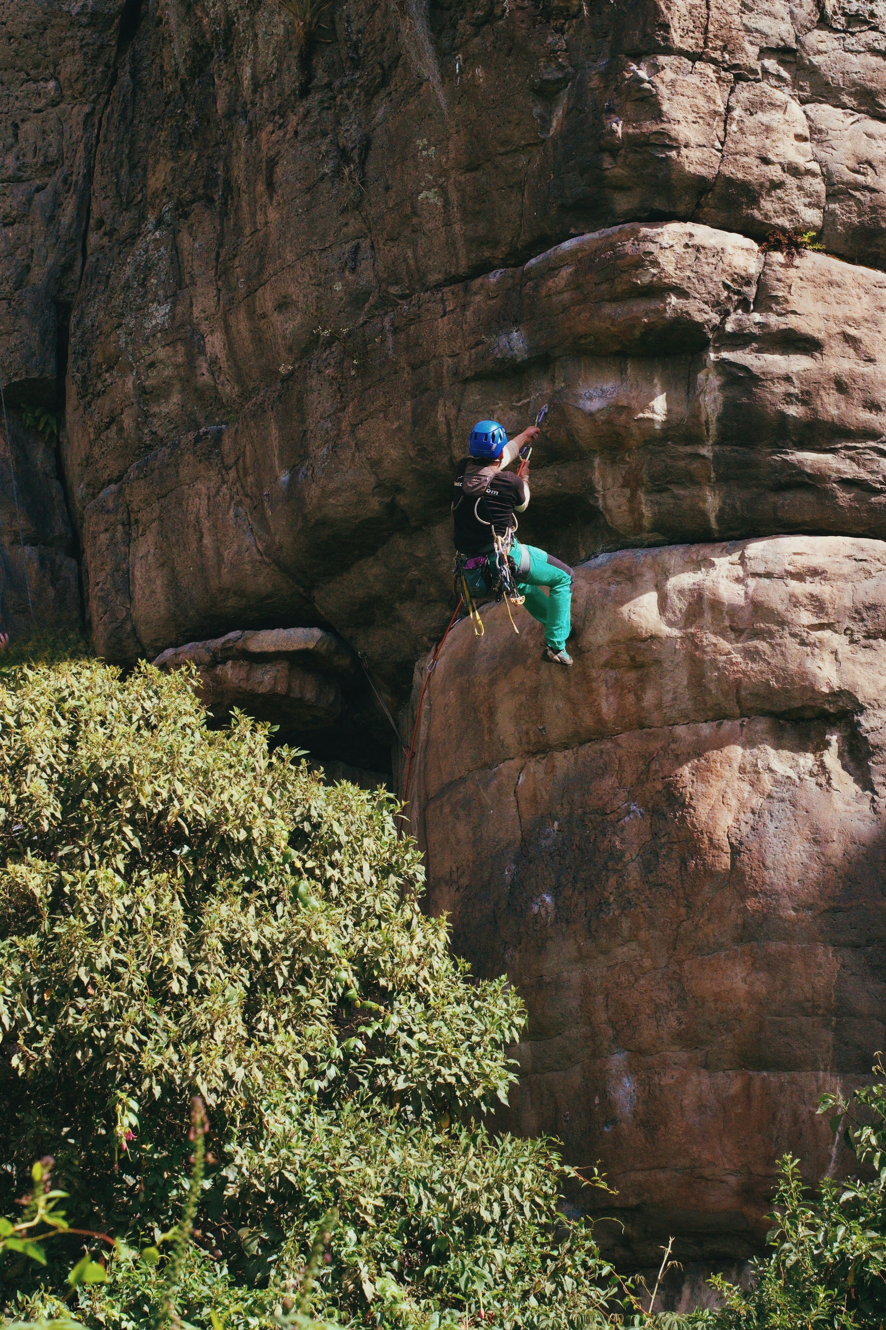 Rope and Resolve: Climber Grapples a Vertical Granite Wall