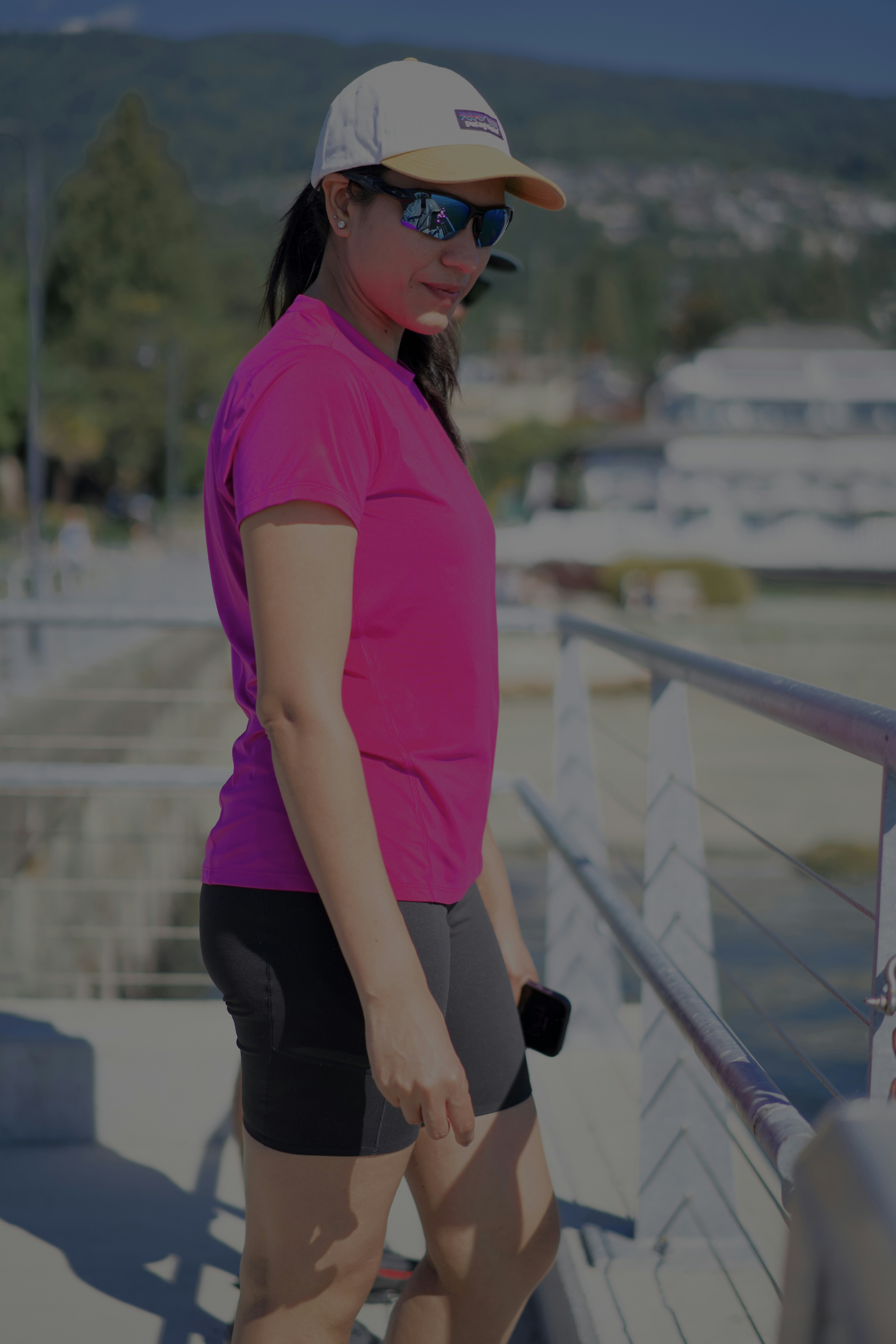 Bright Pink Tee, Quiet Confidence: A Portrait on the Waterfront Boardwalk