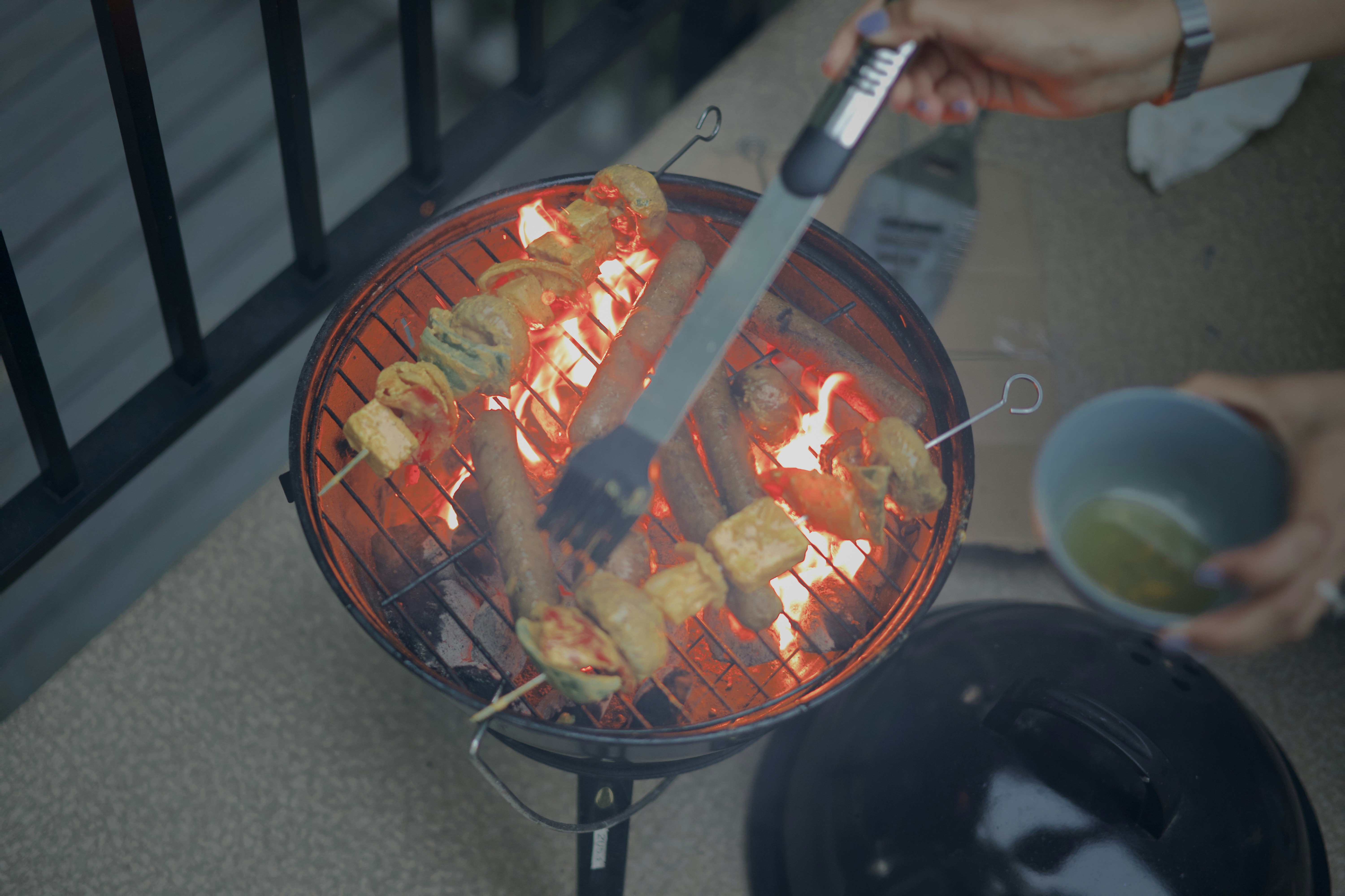 Overhead Grilling: Skewers Sizzle on a Backyard Weber