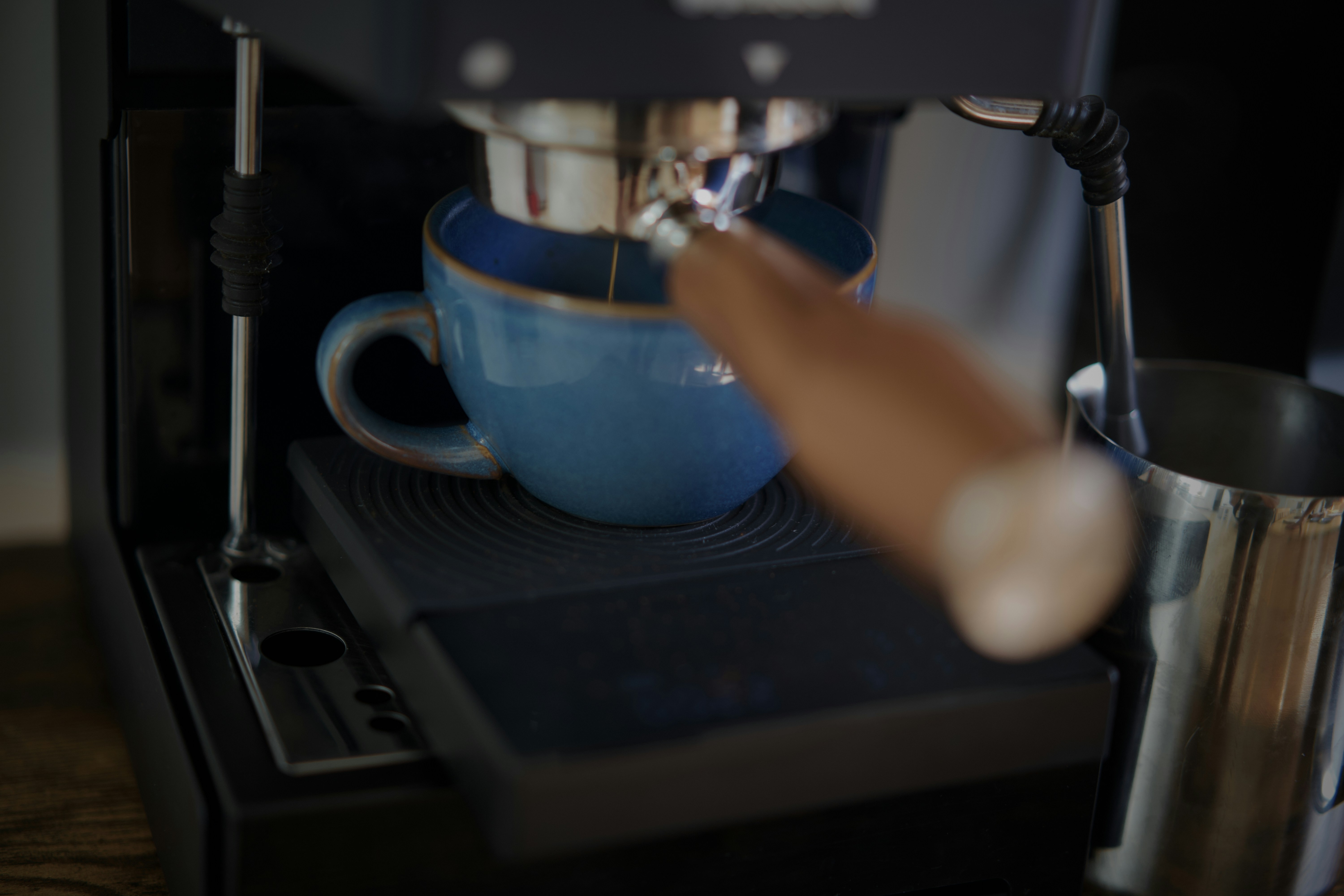Espresso Ritual: Blue Cup Beneath a Quiet Espresso Machine