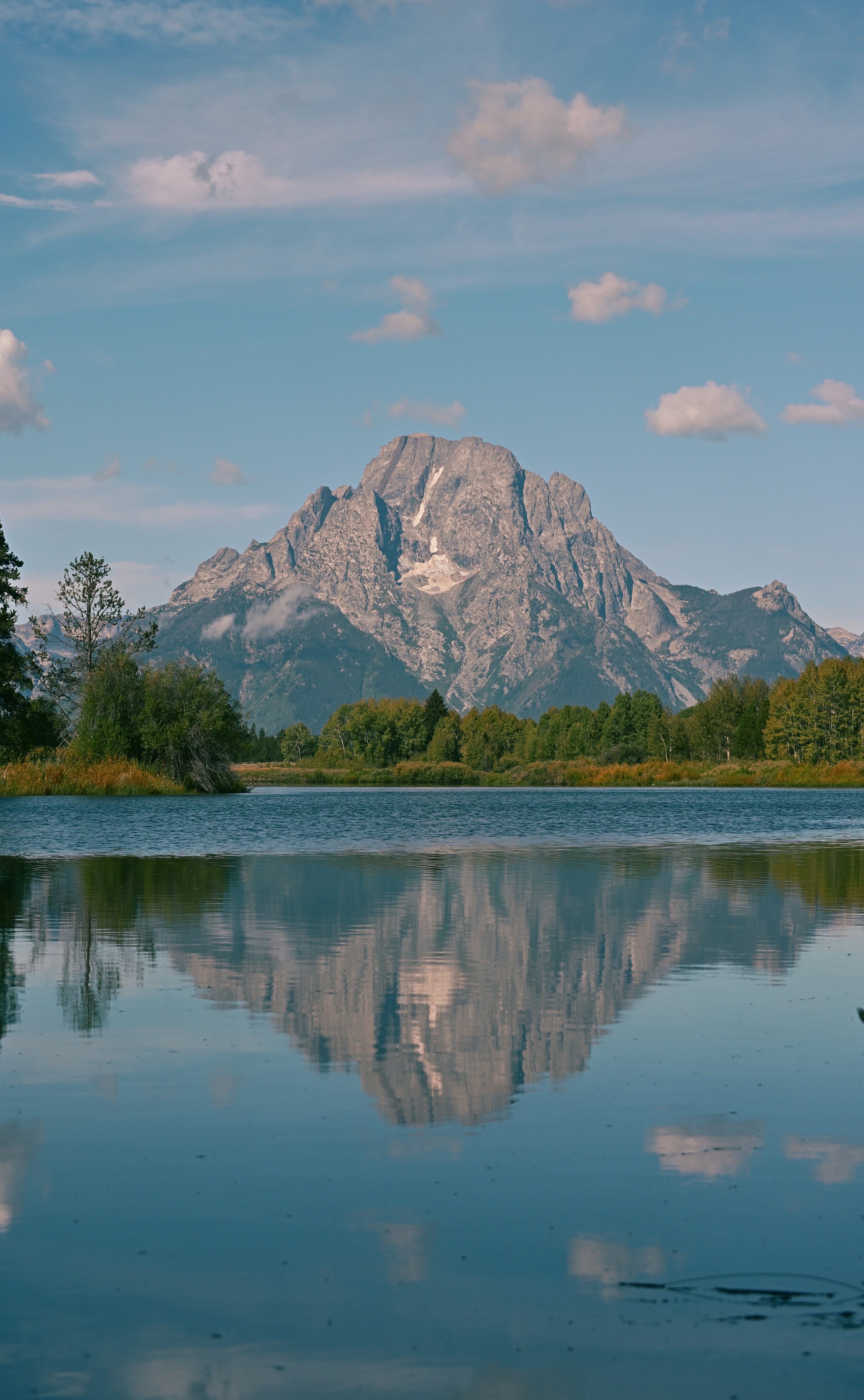 Majestic Peak Meeting a Quiet Lake