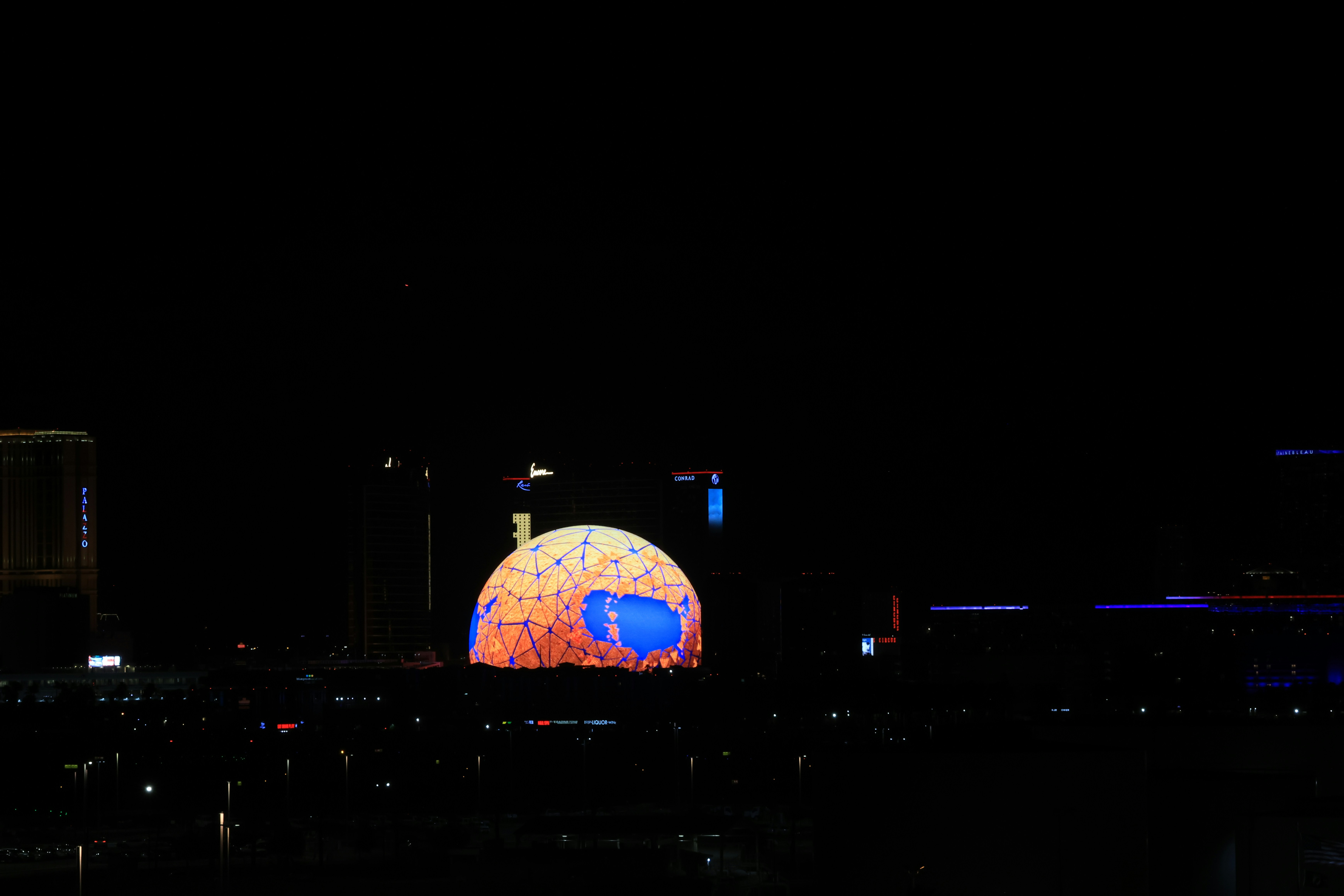 Glowing Geodesic Orb Above a Quiet Night City