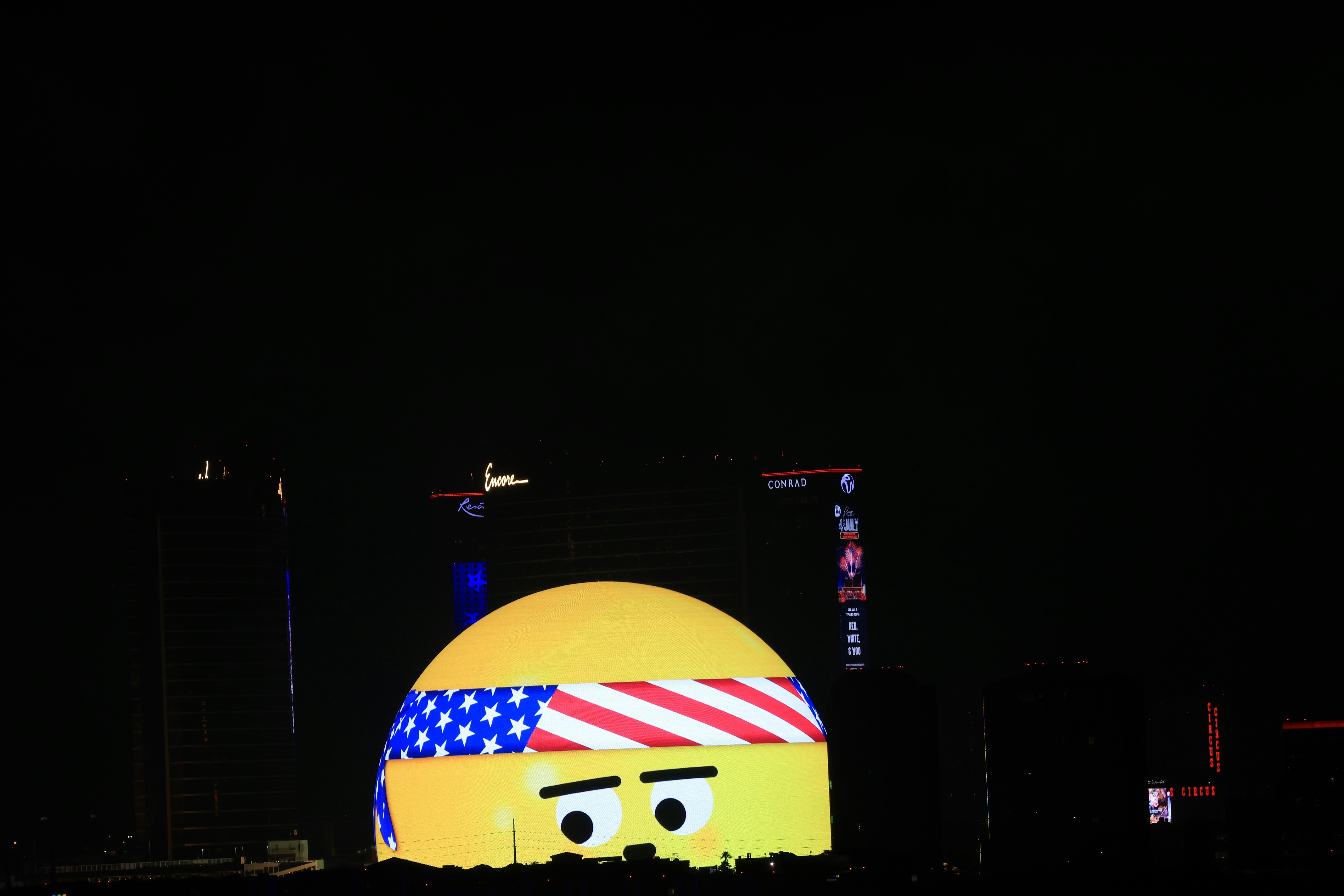 Moonlit Dome: A Giant Emoji Emerges Over the City