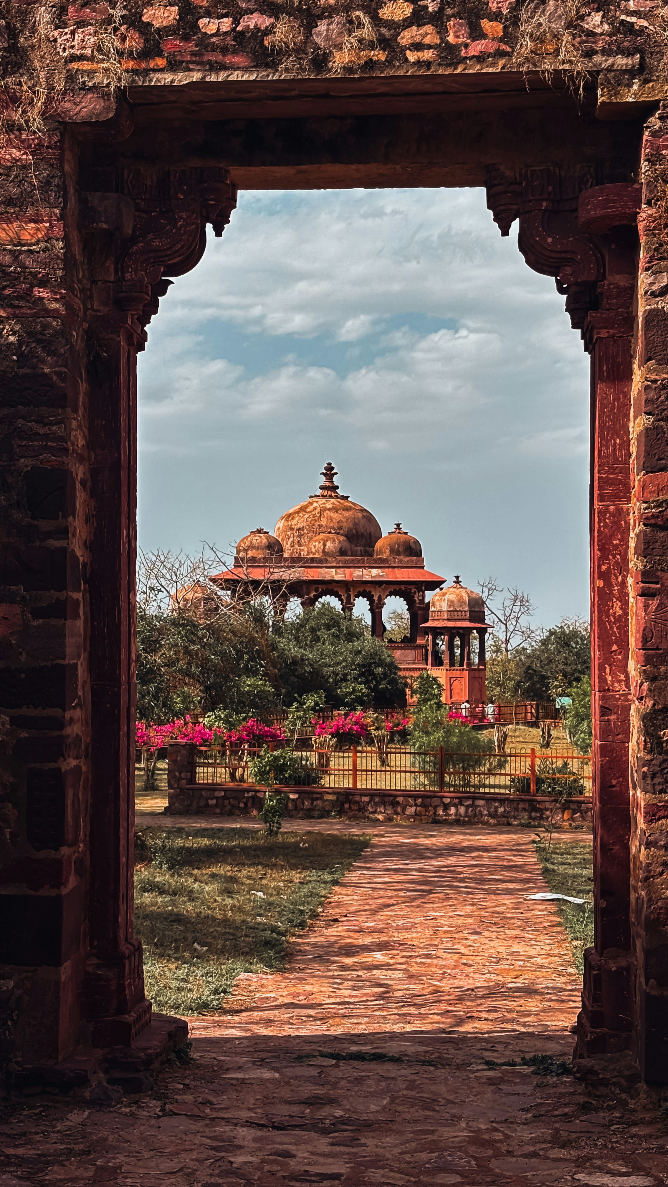 Through the Gate: A Domed Pavilion Framed in Rustic Archways