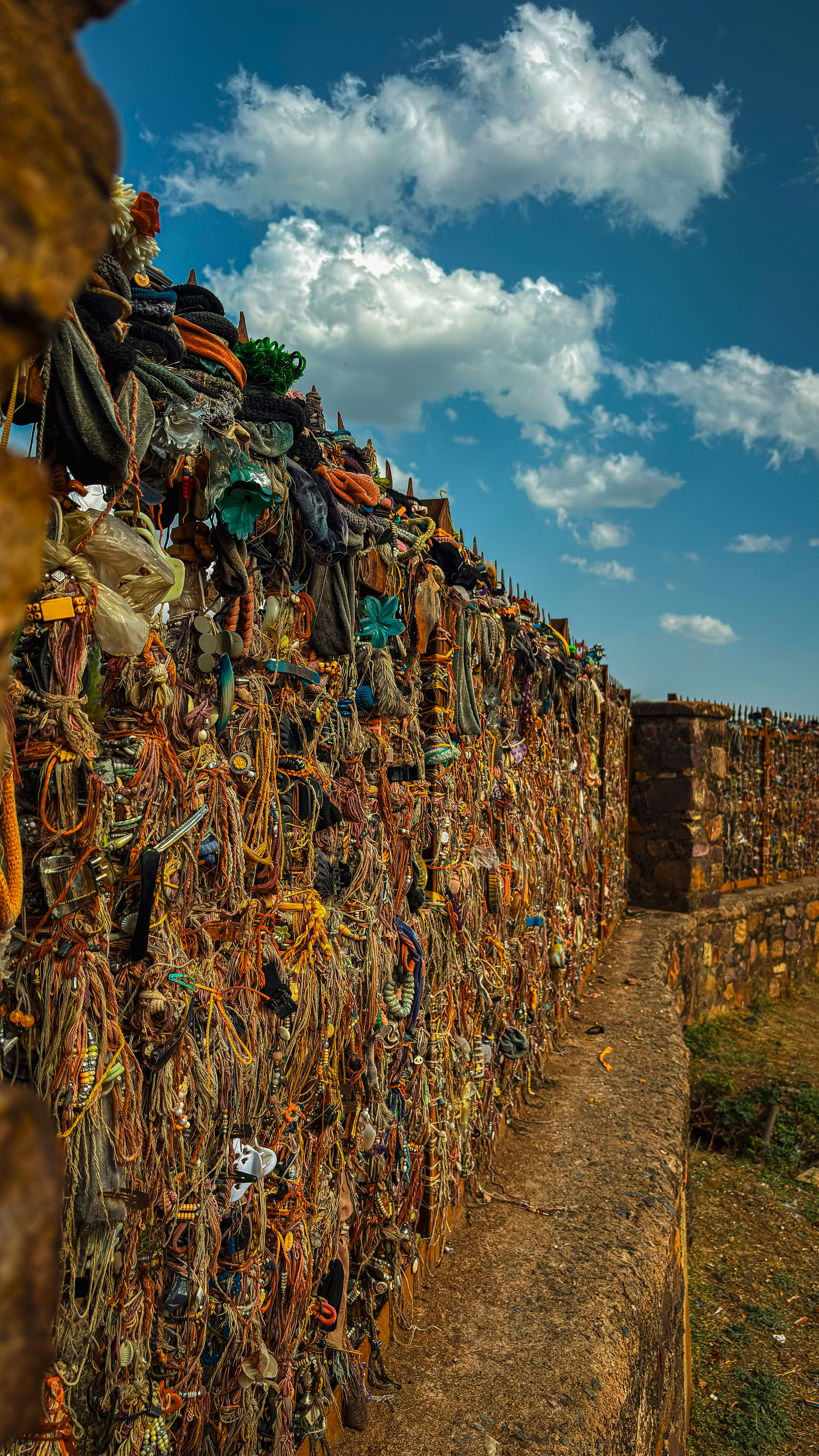 Rope-and-Tangle Wall: A Sculpted Corridor of Offerings Under Open Skies