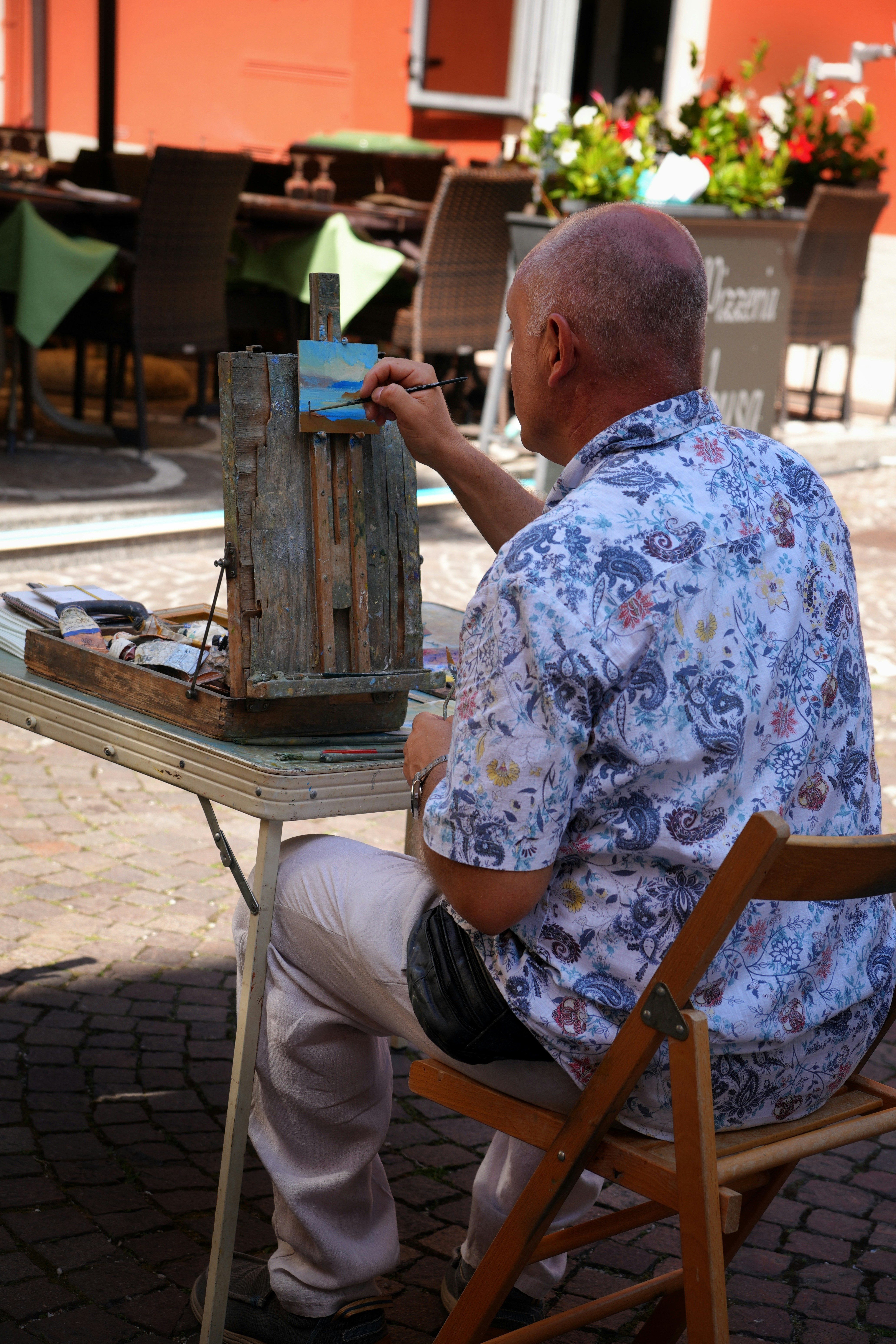 The Urban Painter at Dawn on Cobblestones