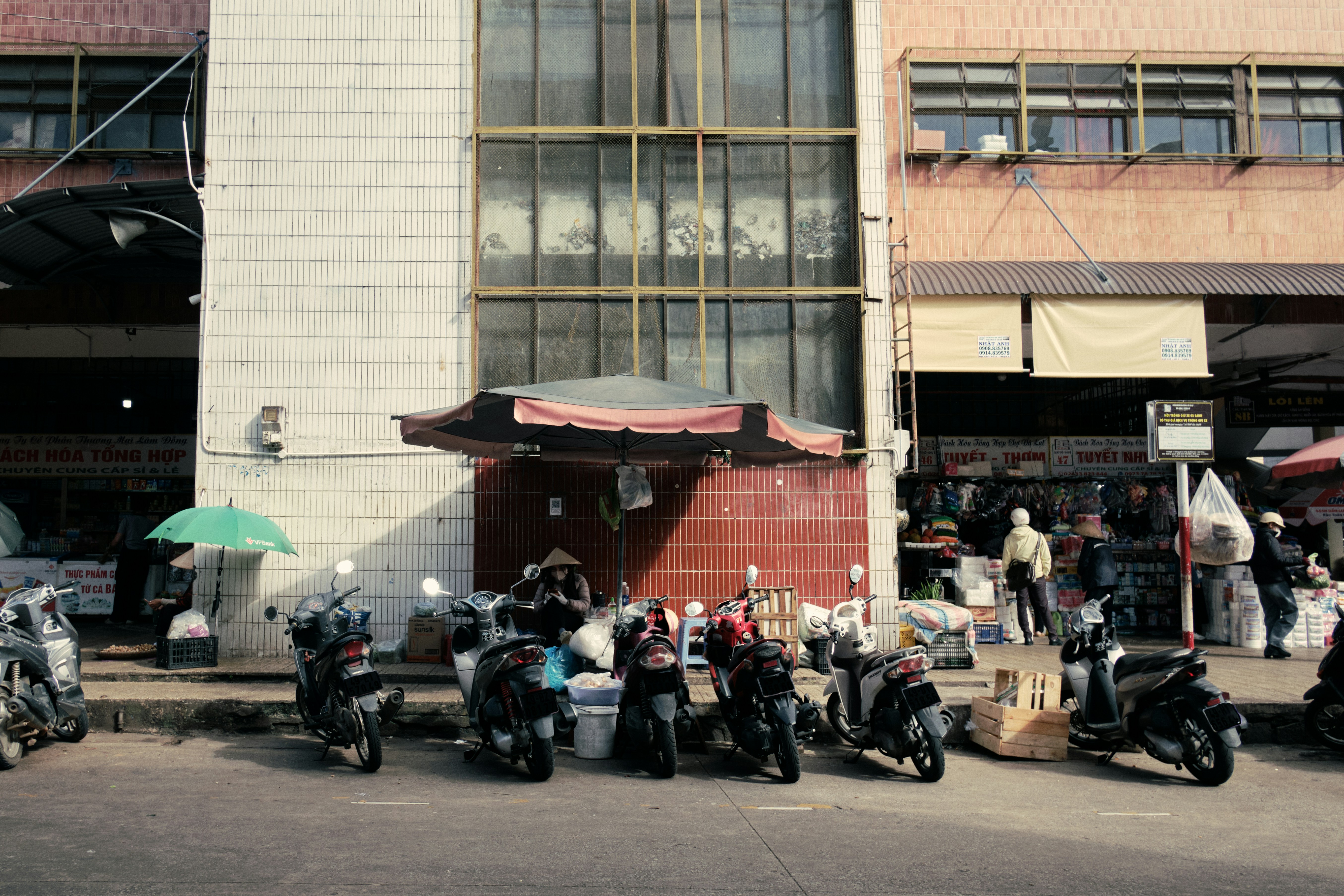 Marketfront Portrait under Aisle of Motorbikes