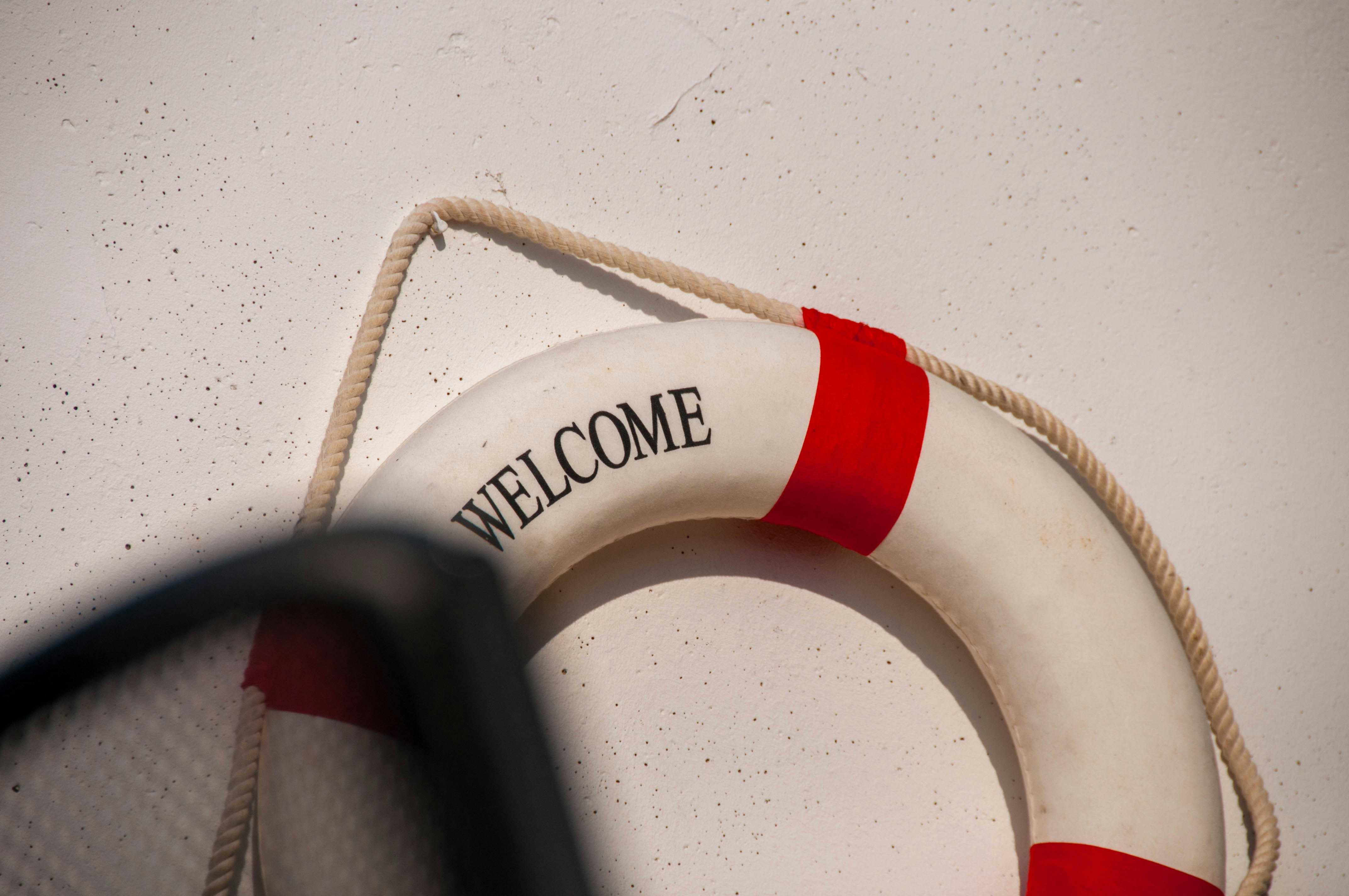 Welcome Afloat: A Lifebuoy Framed by a Subtle Blur