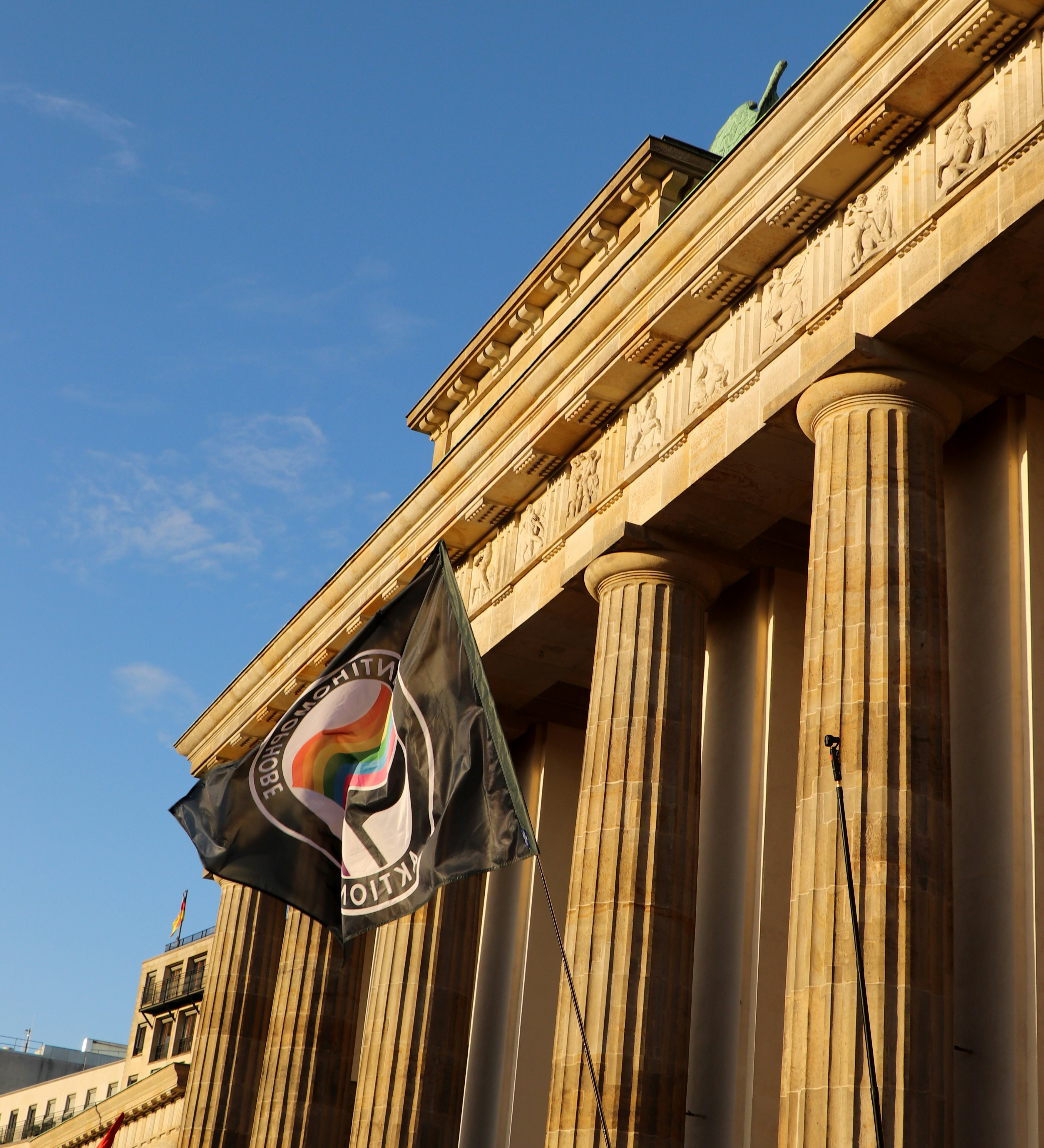 Flagovered Facade: A Flag Waving Beneath Classical Columns