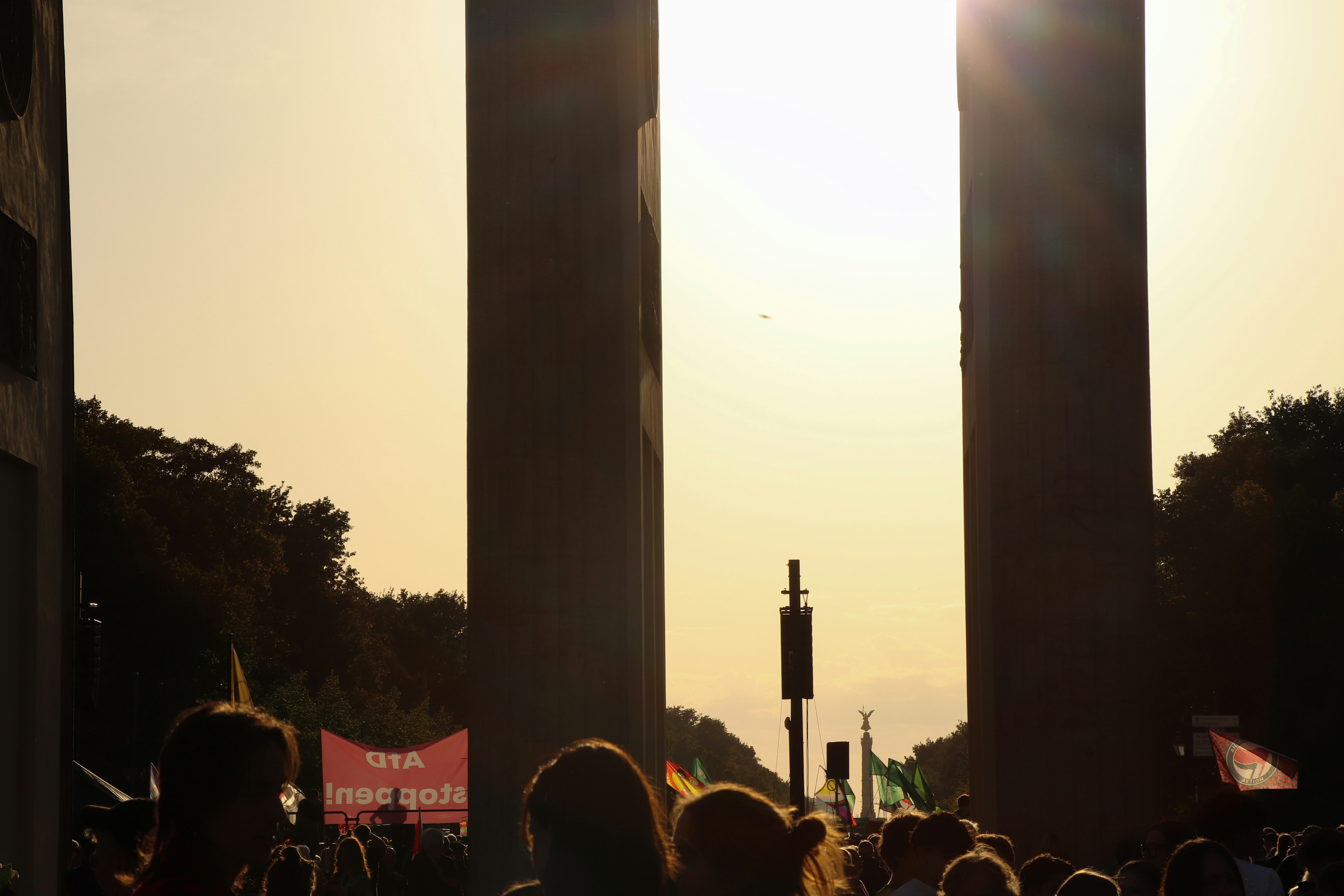 Silhouette Amid Monolithic Columns at Dusk Festival