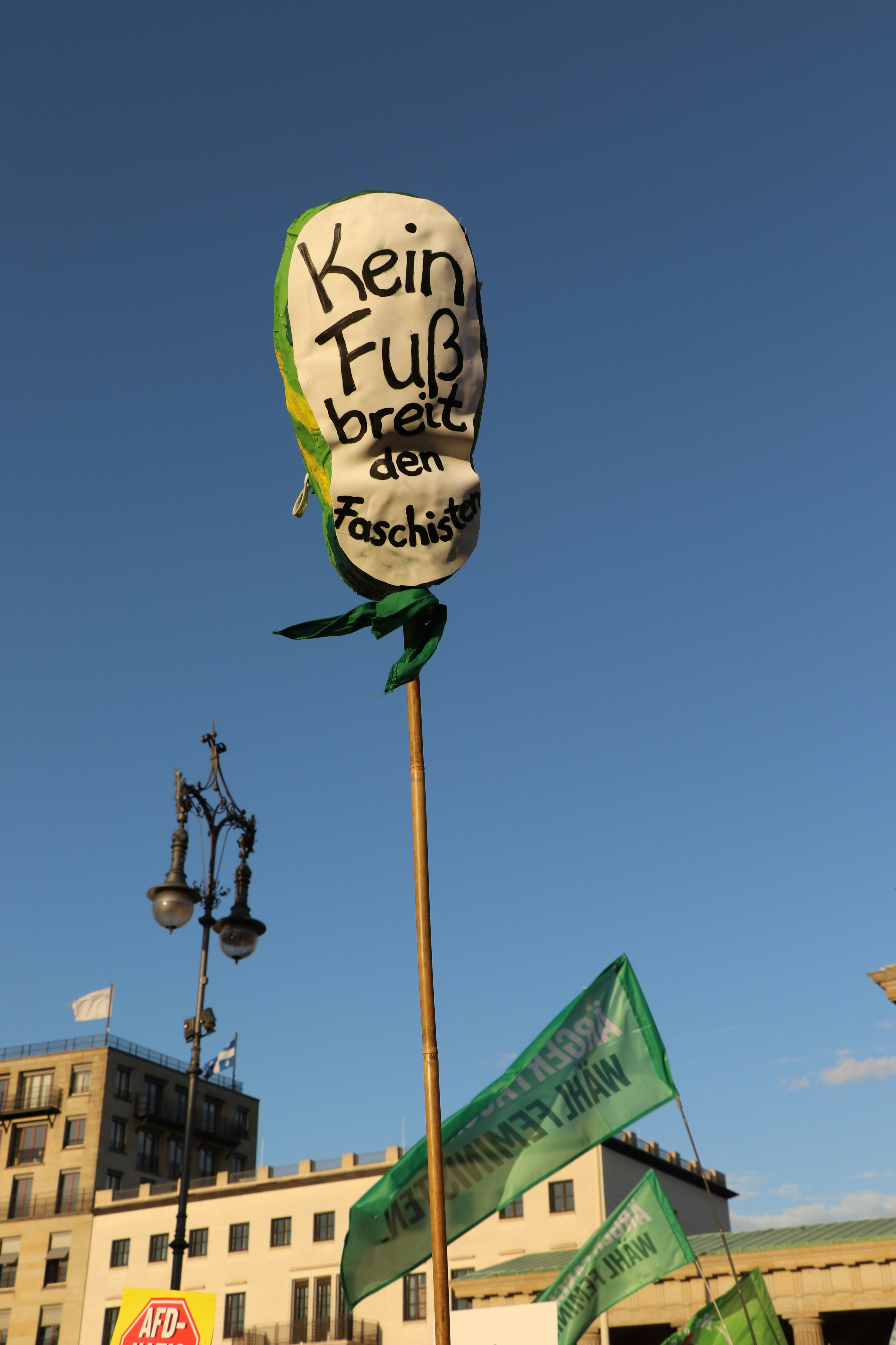 Propaganda Balloon on a Tall Stick Stares into a Clear Sky