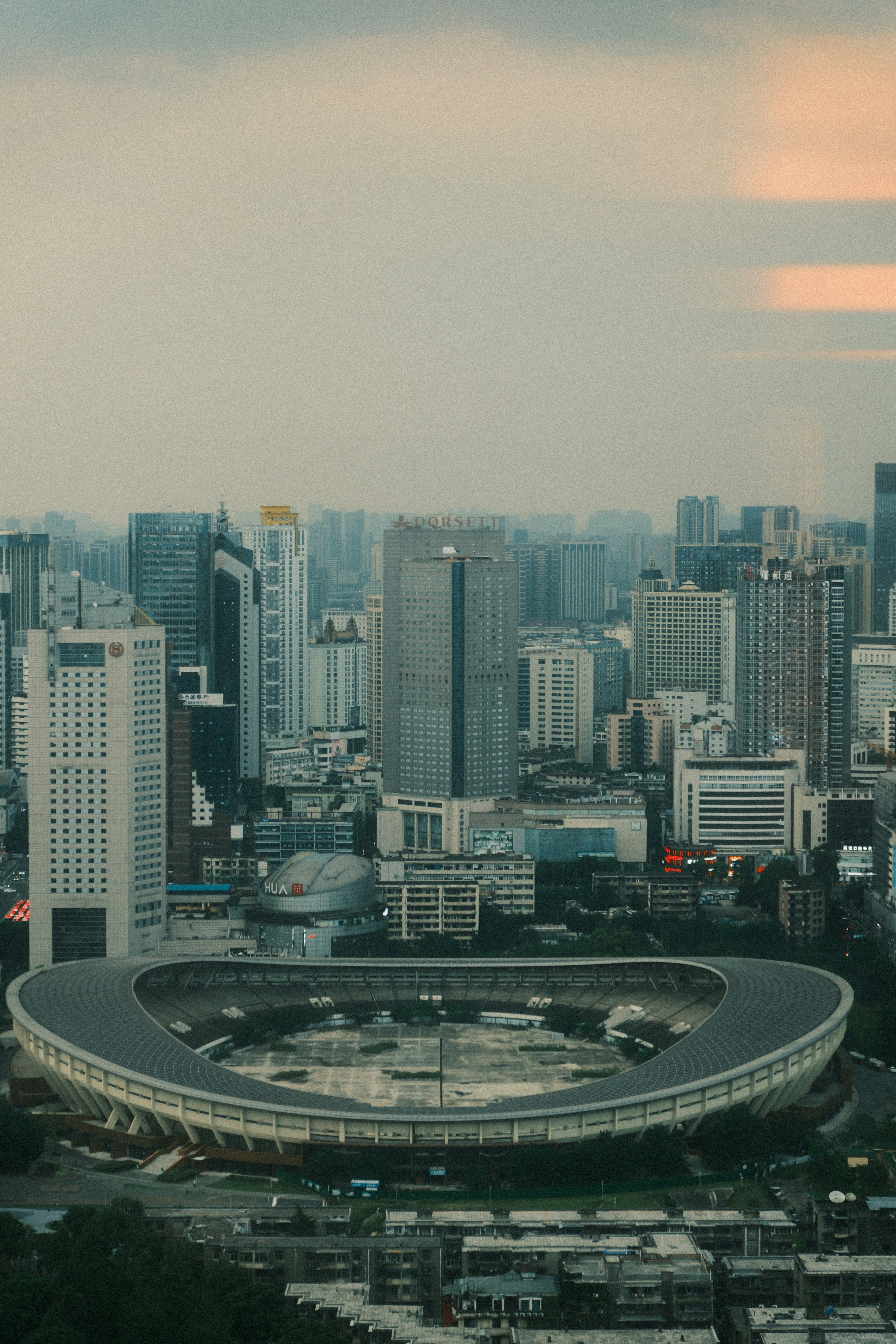 City Stadium Silhouette: An Aerial View Over a Dense Urban Core