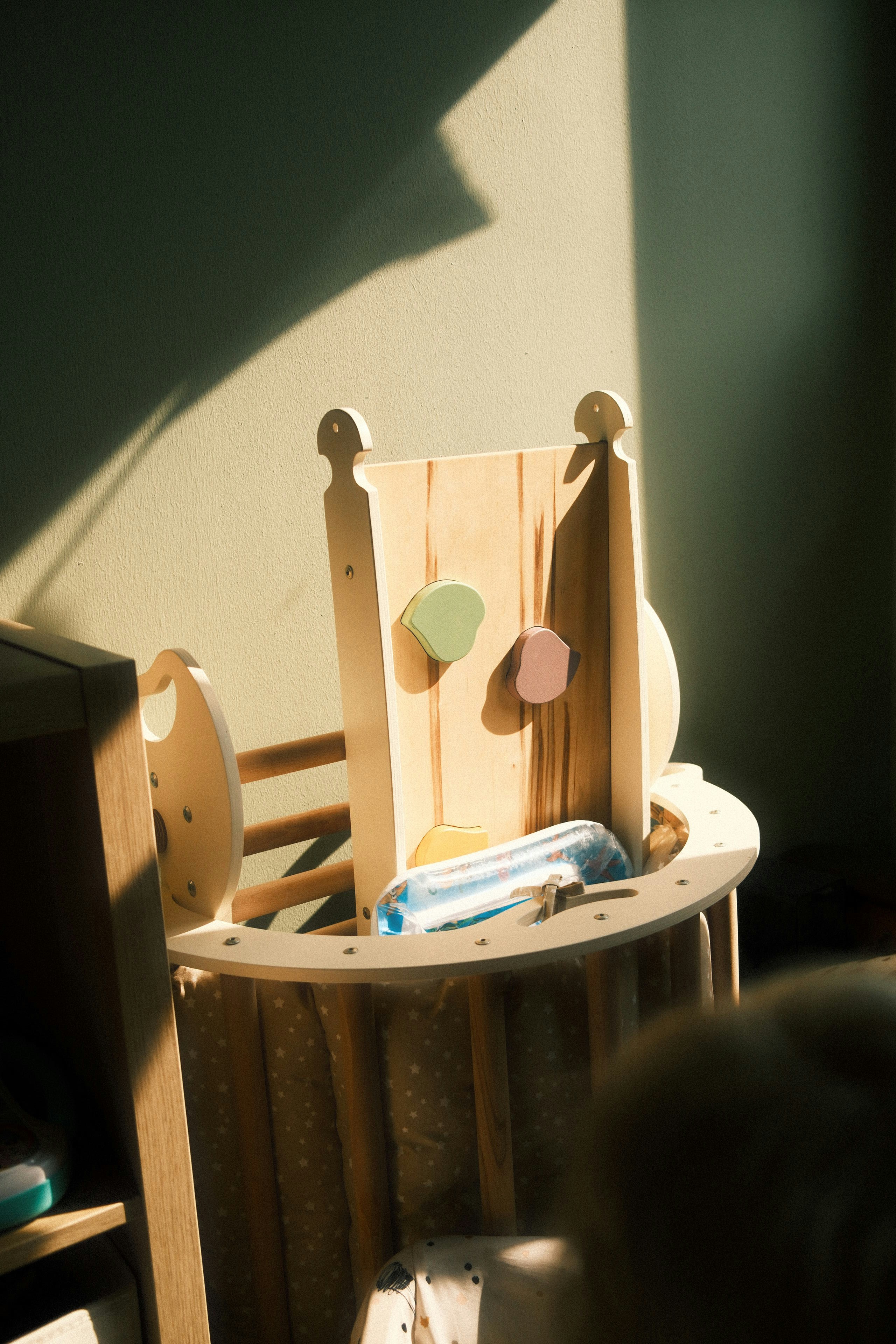 Shadows and Craft: Sunlit Corner with Wooden Puzzle Stand
