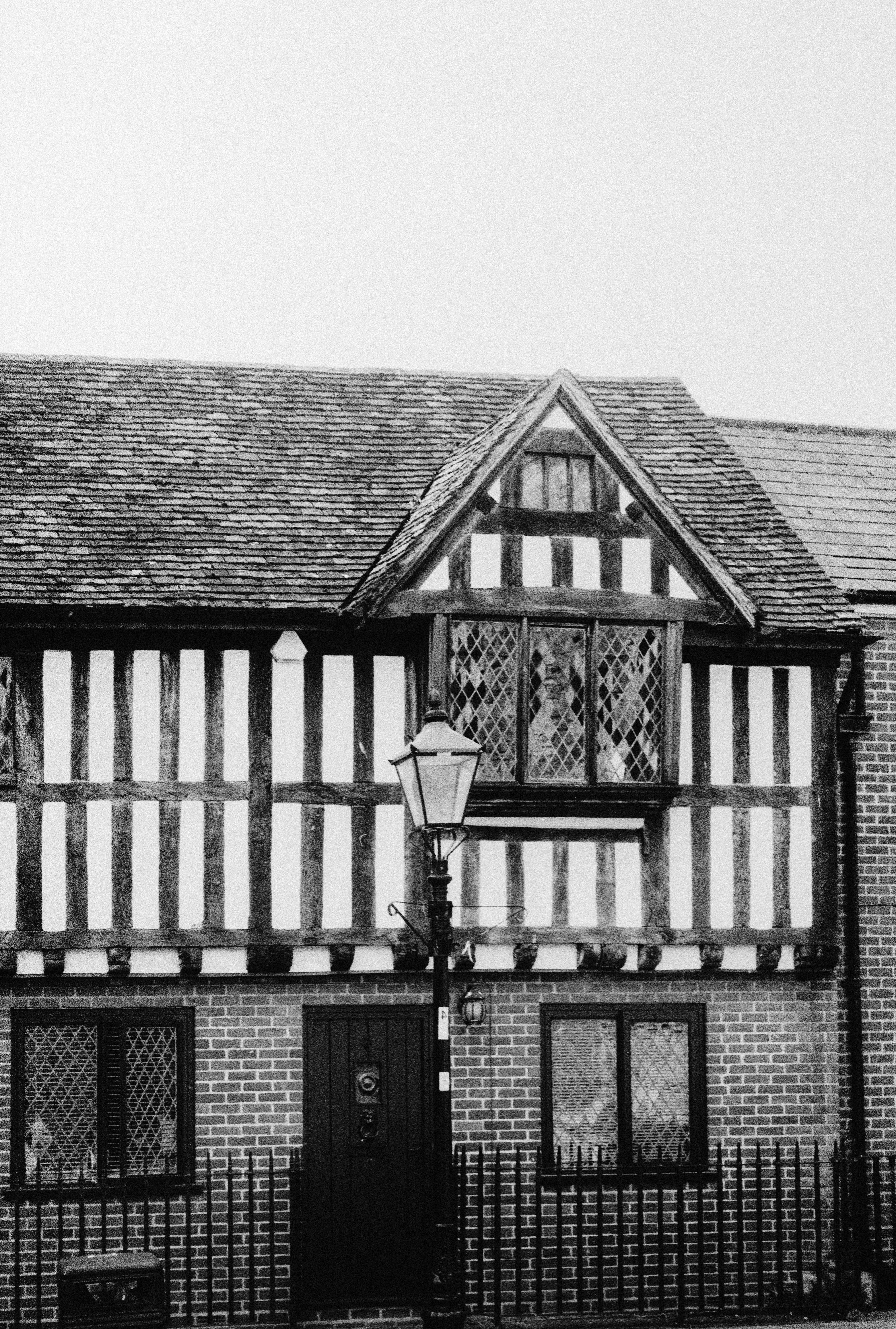 Timbered Facade in Monochrome: A Gabled Cottage with Lantern