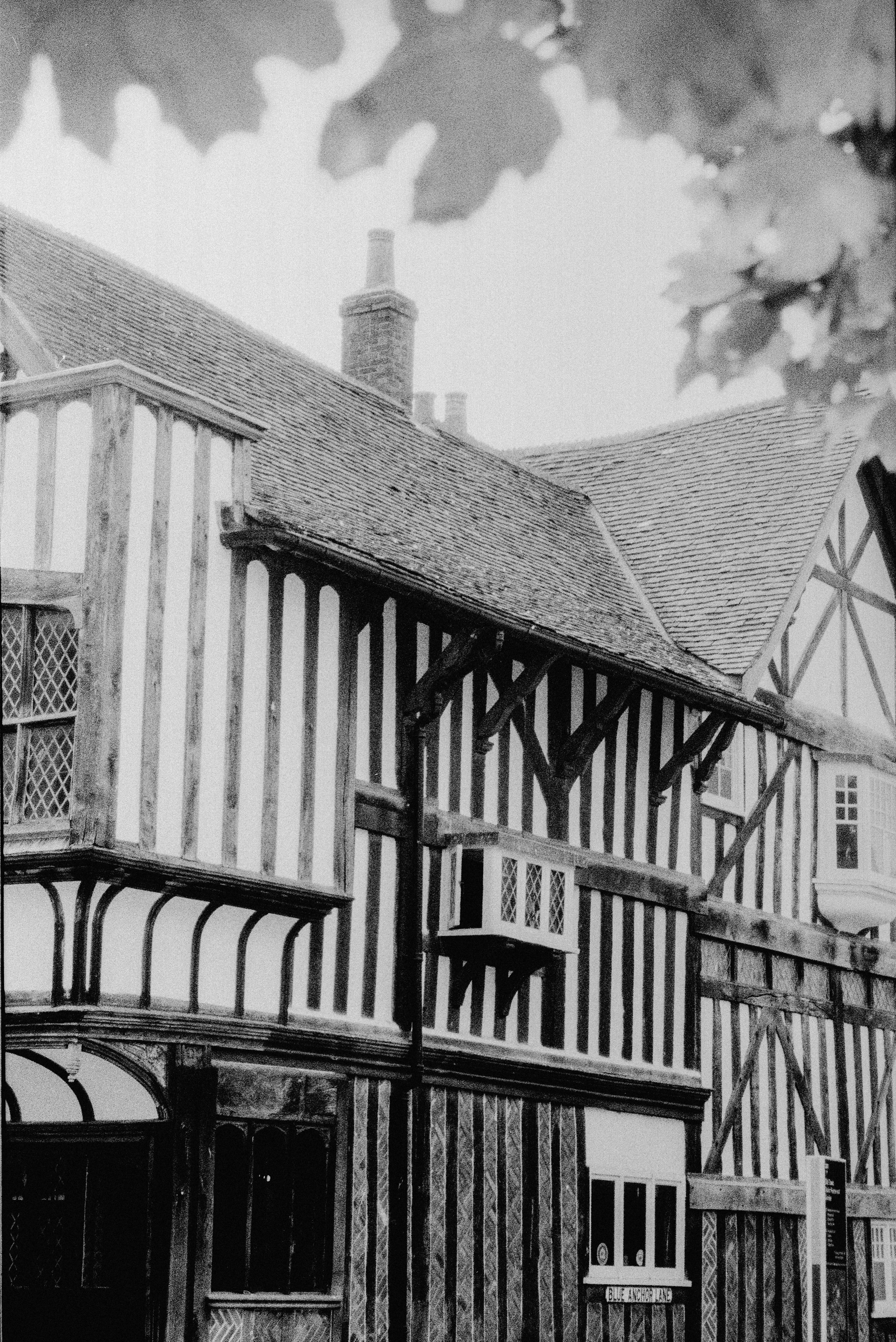 Black-and-white Tudor Facade: Timber, Tiles, and Time