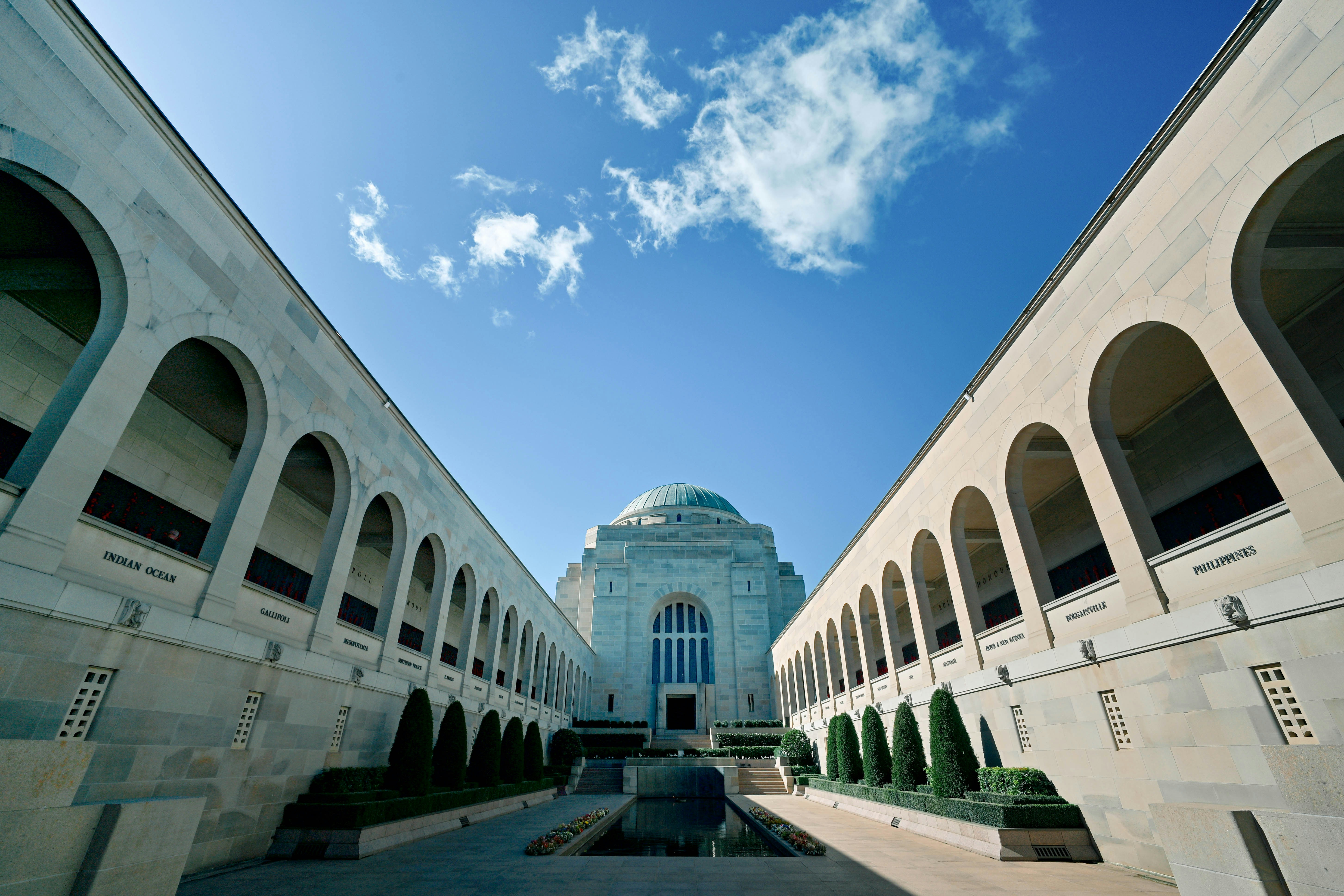 Symmetrical Axis: The Grand Archway of a Marble Academy