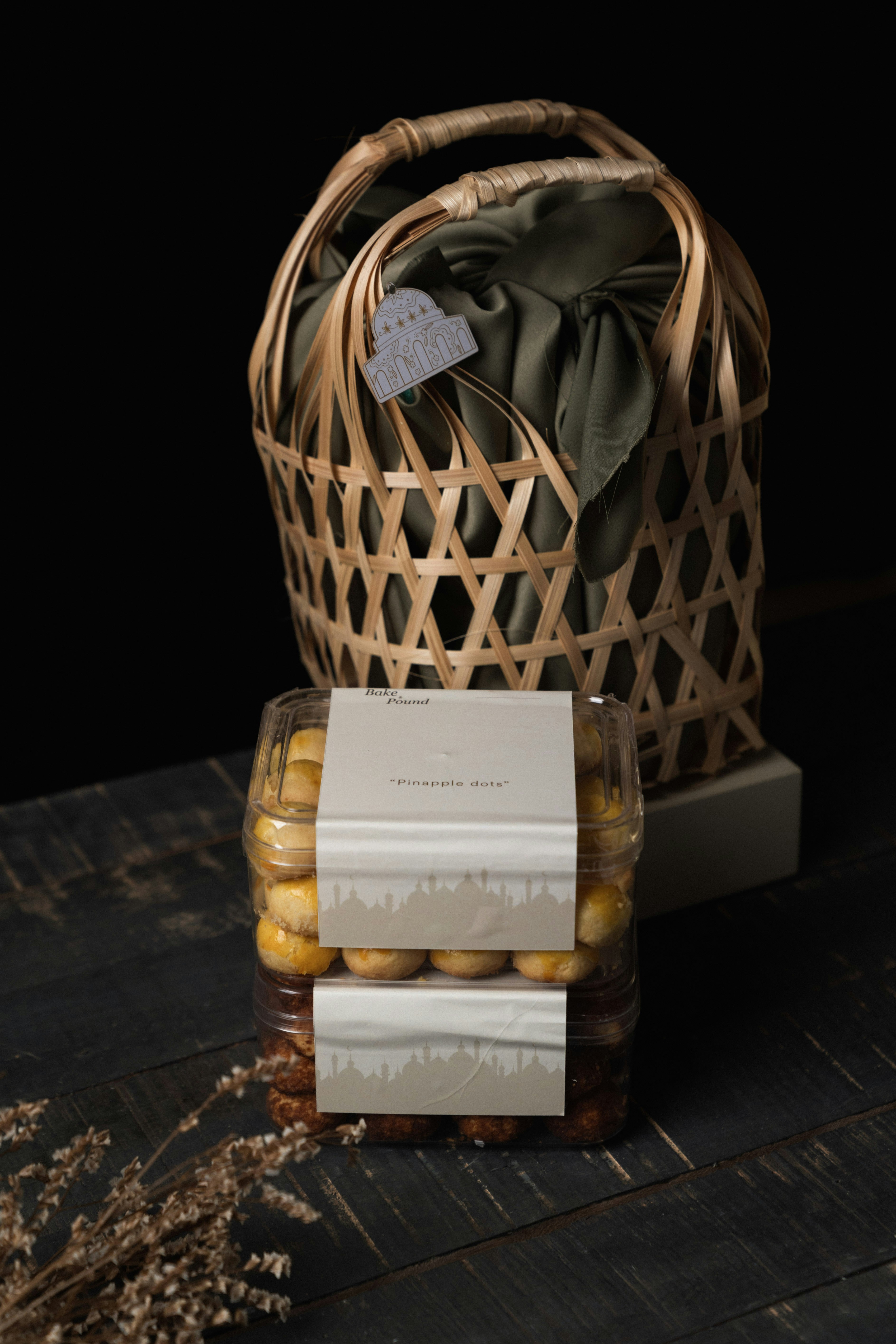 Basket of treats: a quiet still life with a woven basket and stacked confections
