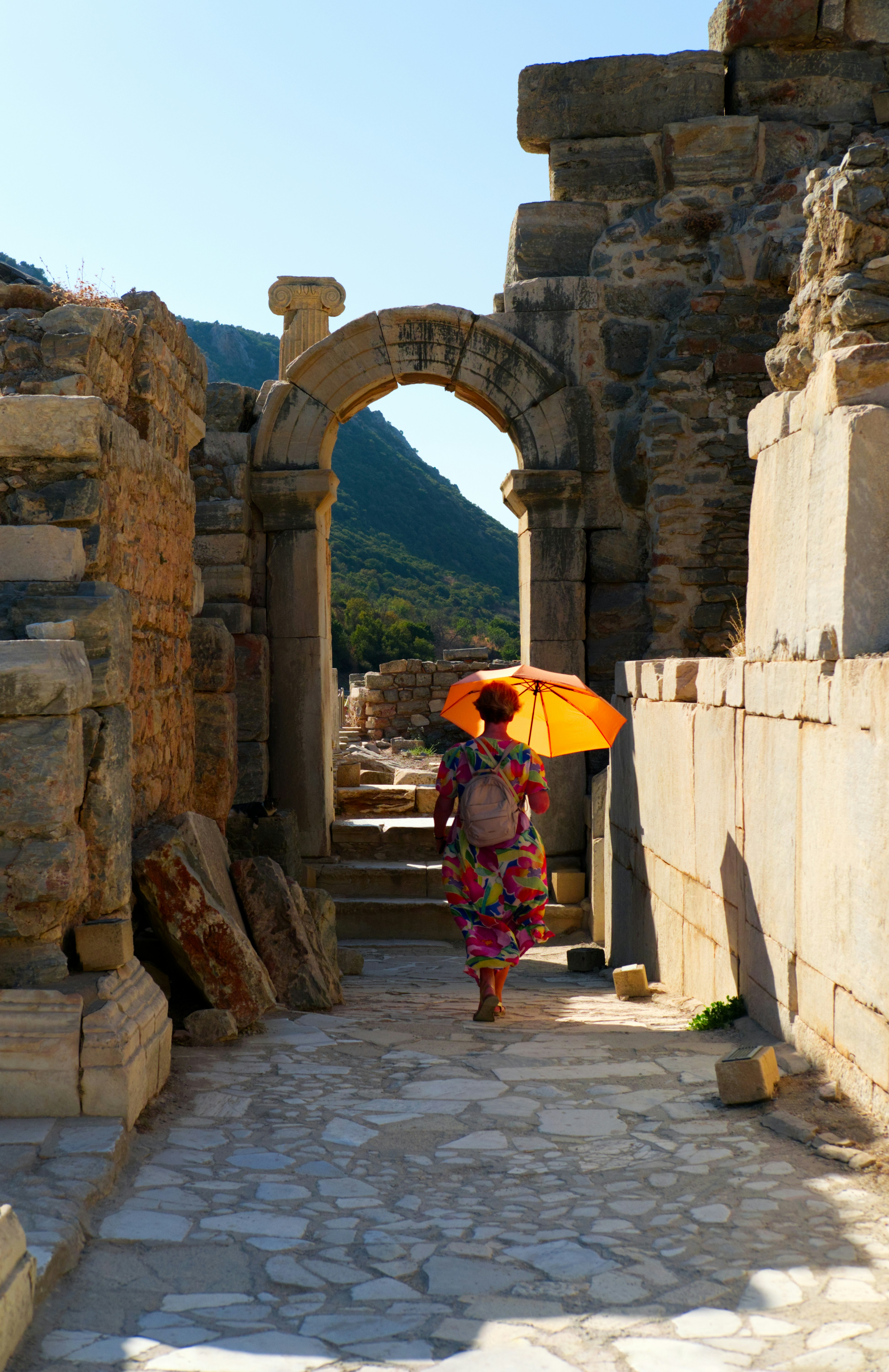 Umbrella Path Through Ancient Archways