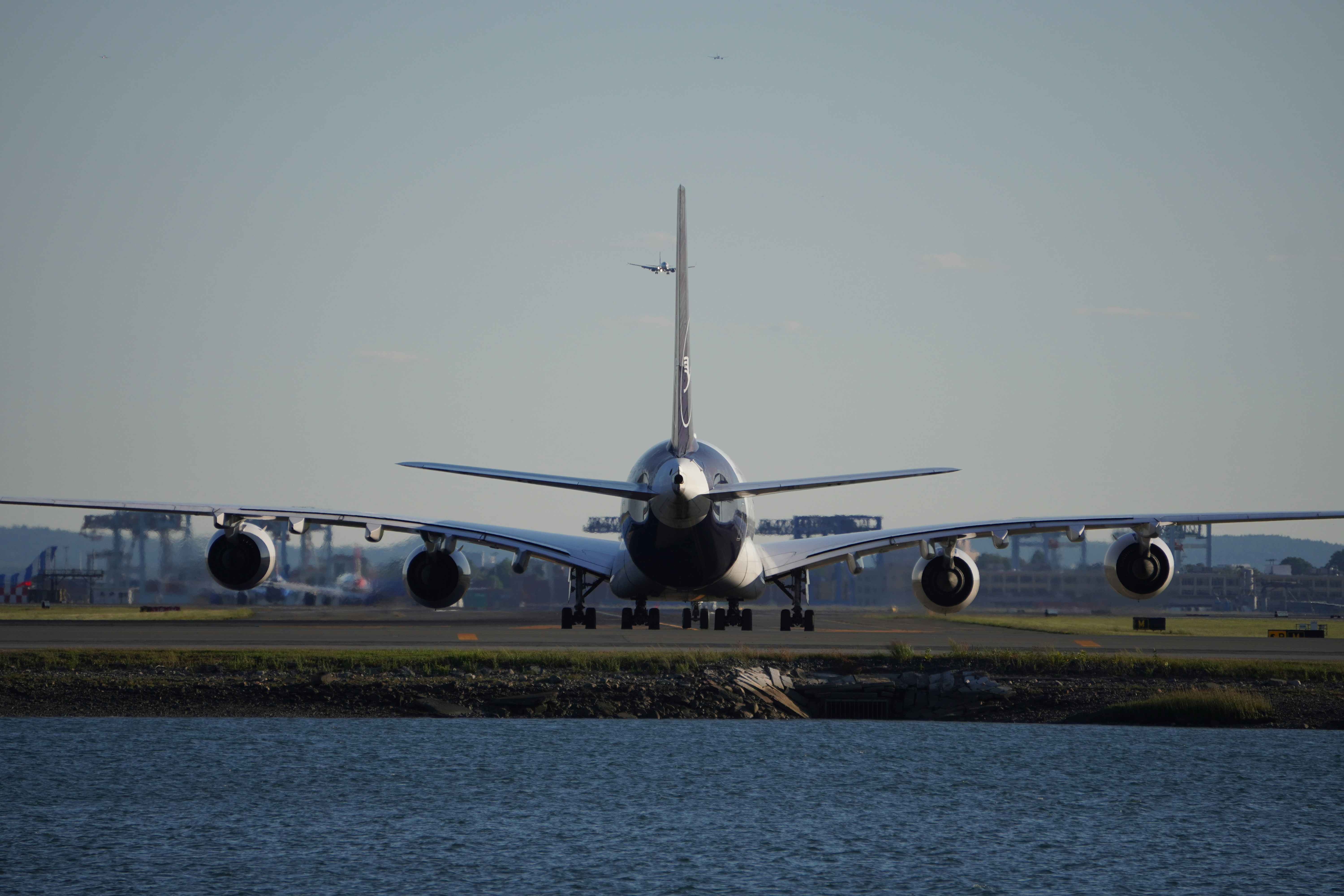 Centered Giant: Front View of a Quad-Engine Jet at the Runway