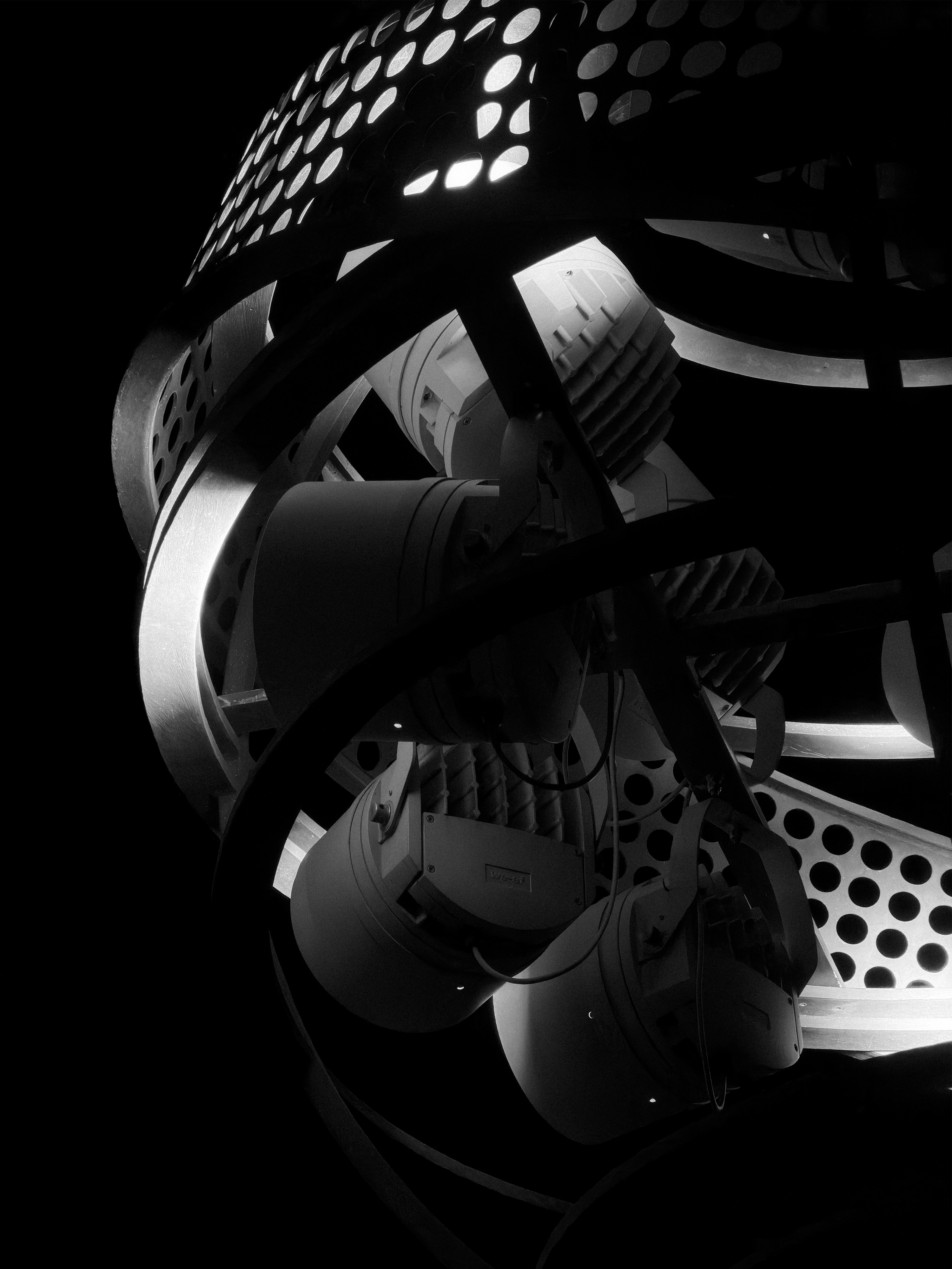Industrial Geometry: A Close-Up of Quiet Machinery in Shadow