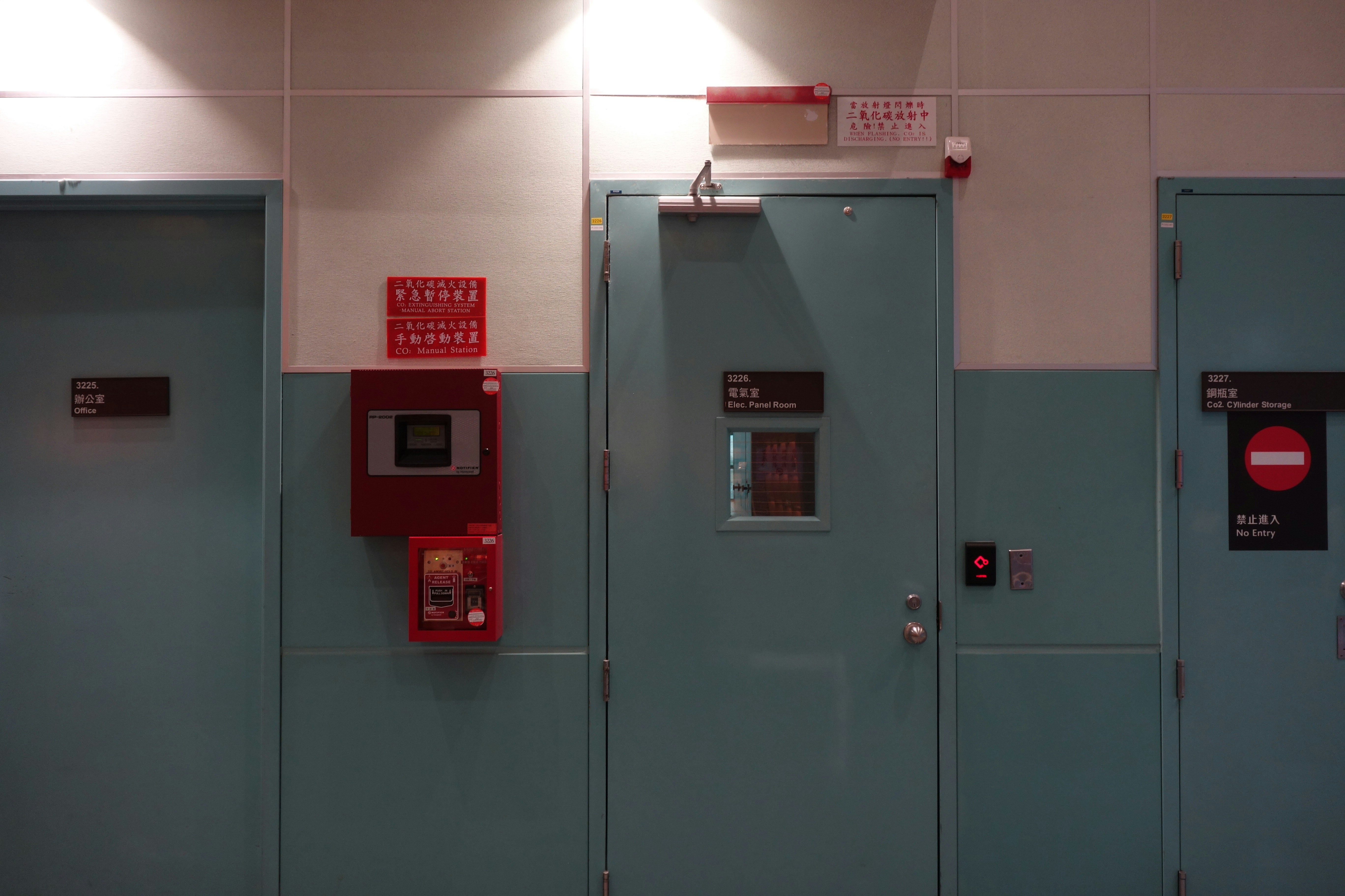 Teal Doors and Red Alarm: A Quiet Corridor of Precision