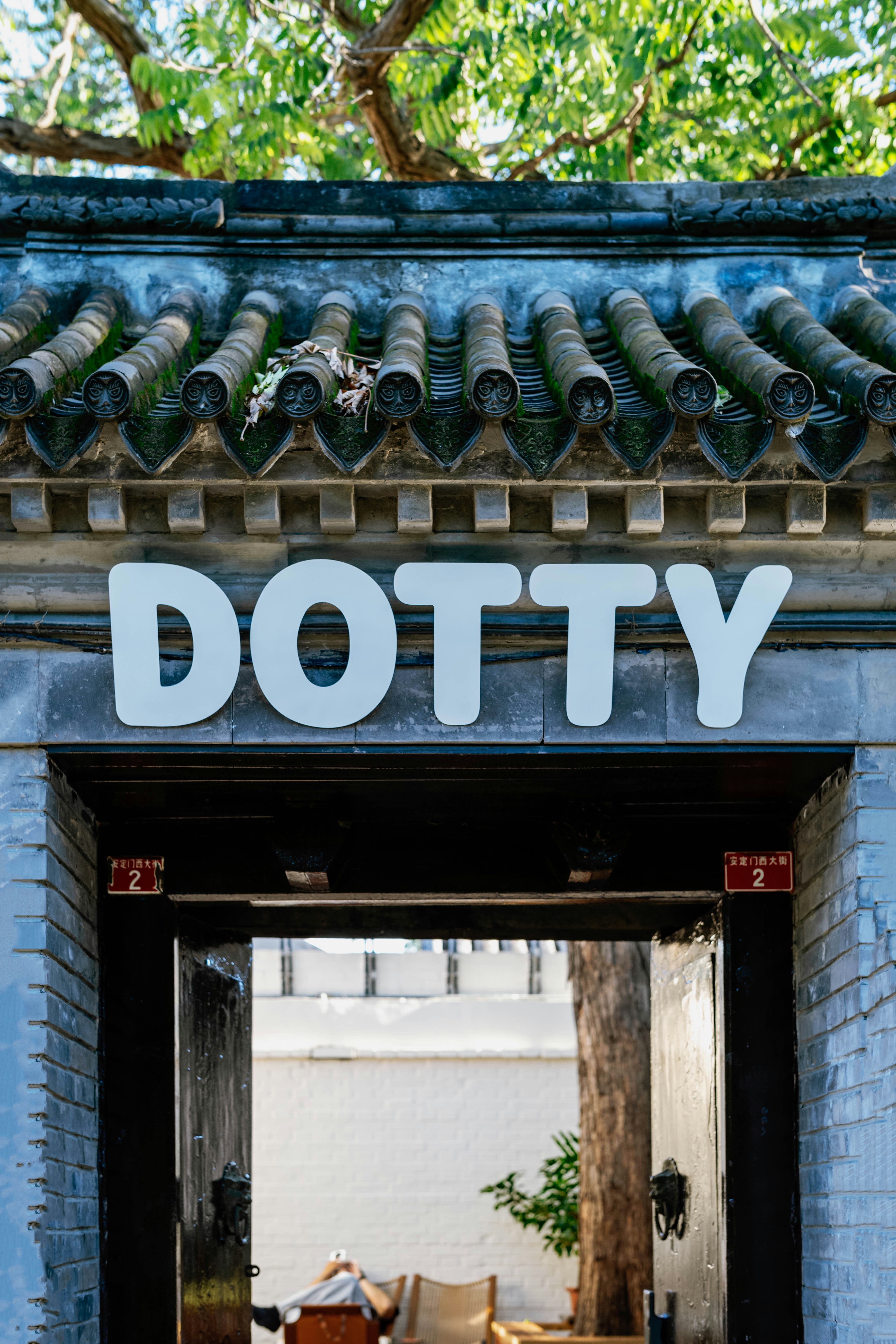 DOTTY Gate: A Quiet Portrait Beneath a Traditional Roof