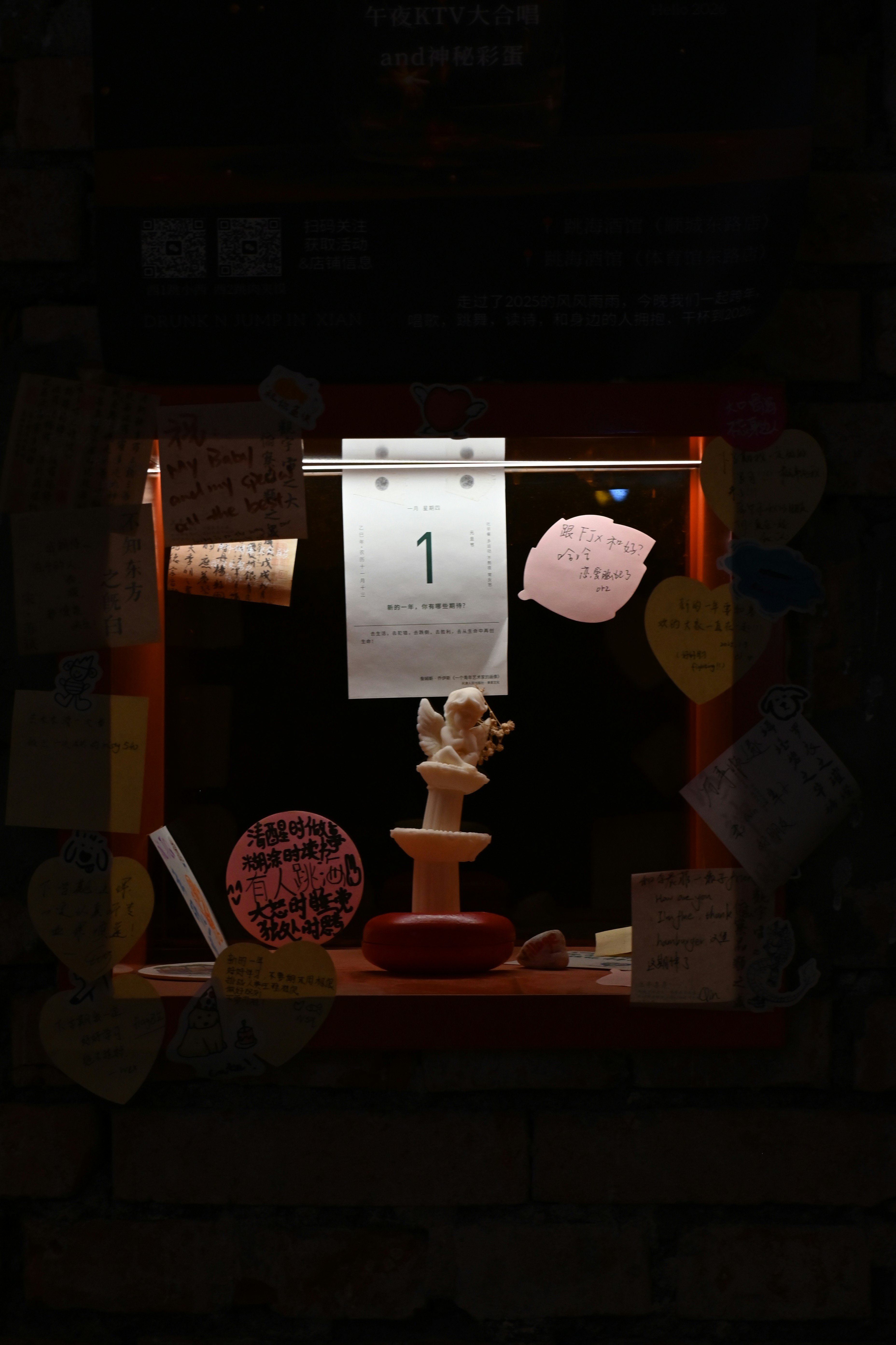 Calendar Spotlight: A Delicate Sculpture Brought to Quiet Life under a Window of Post-it Confessions