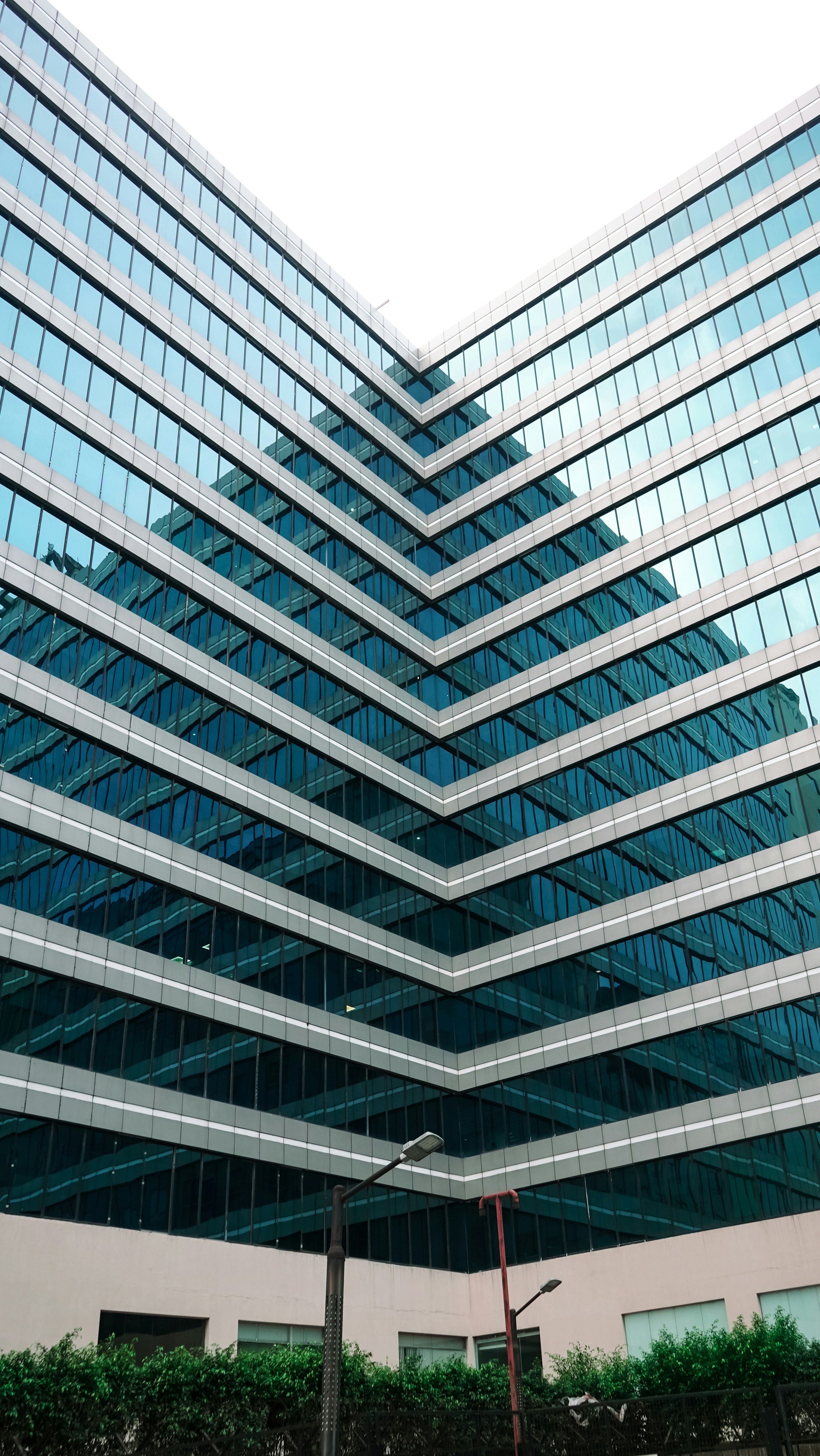 Chevron of Glass: Converging Edges in a Modern Facade