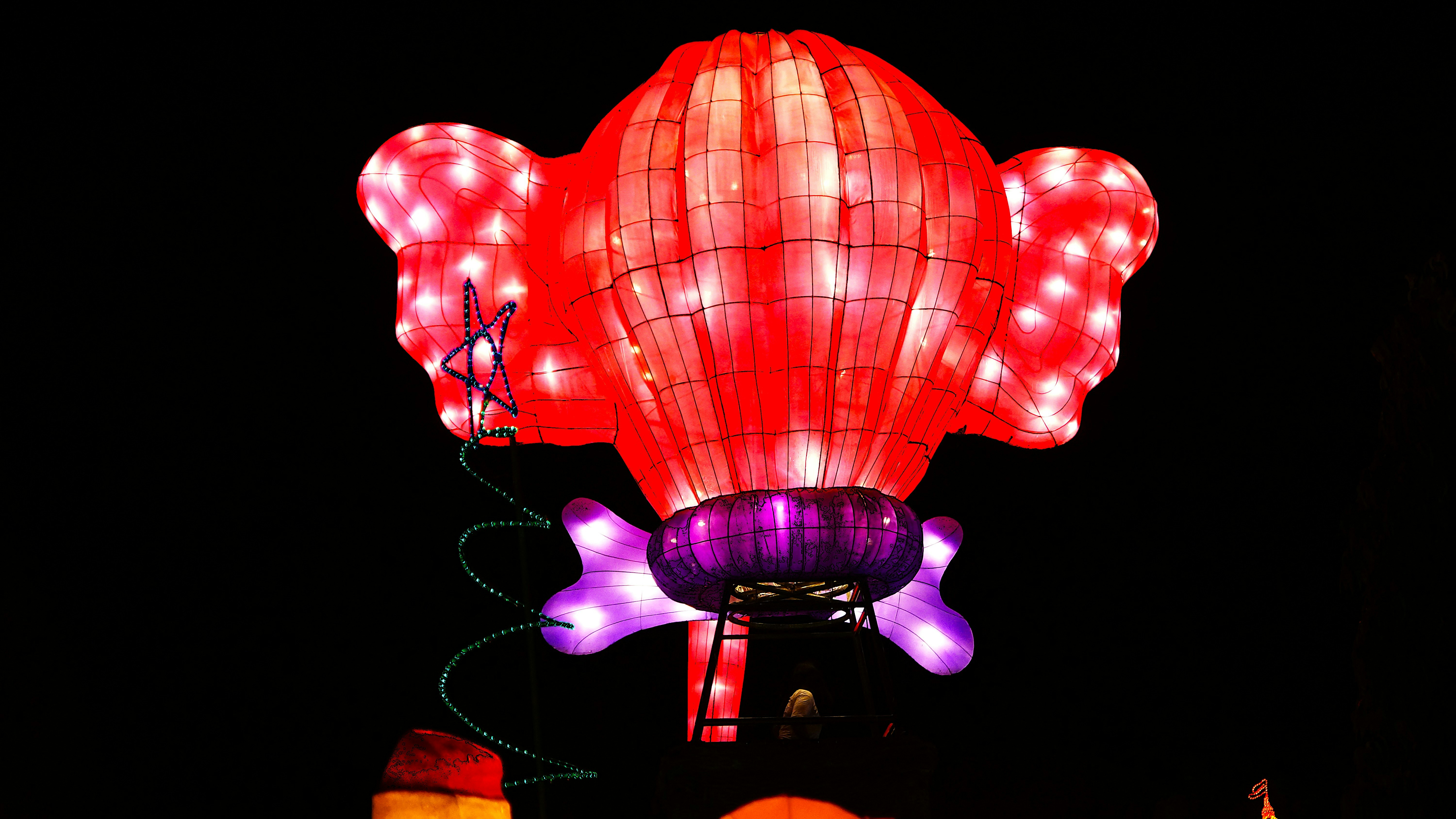 Lantern Ascendant: A Neon Octopus Balloon Lights Up the Night Parade