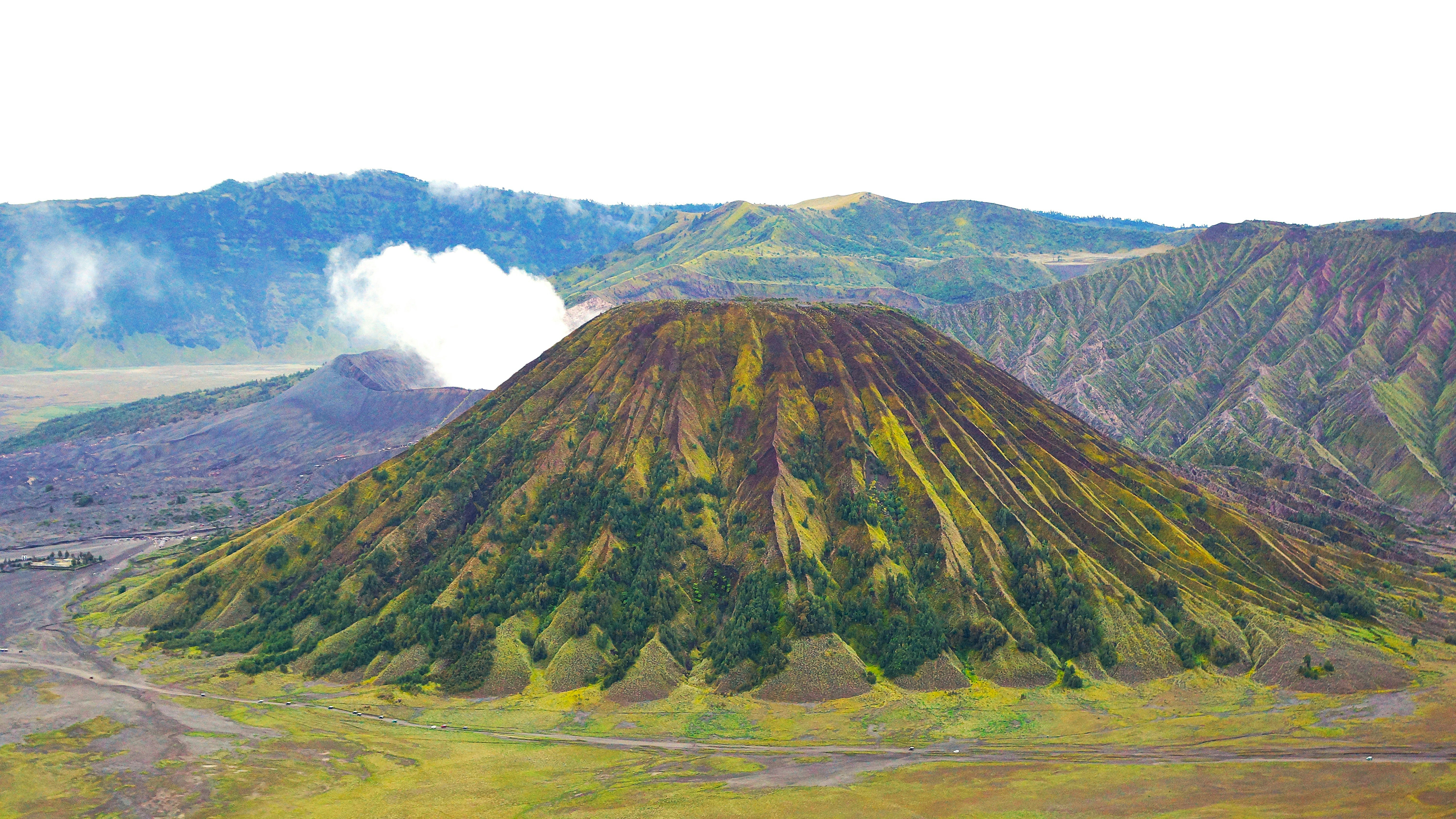 Emerald Cones: A Volcanic Dome Framed by Rifted Landscape