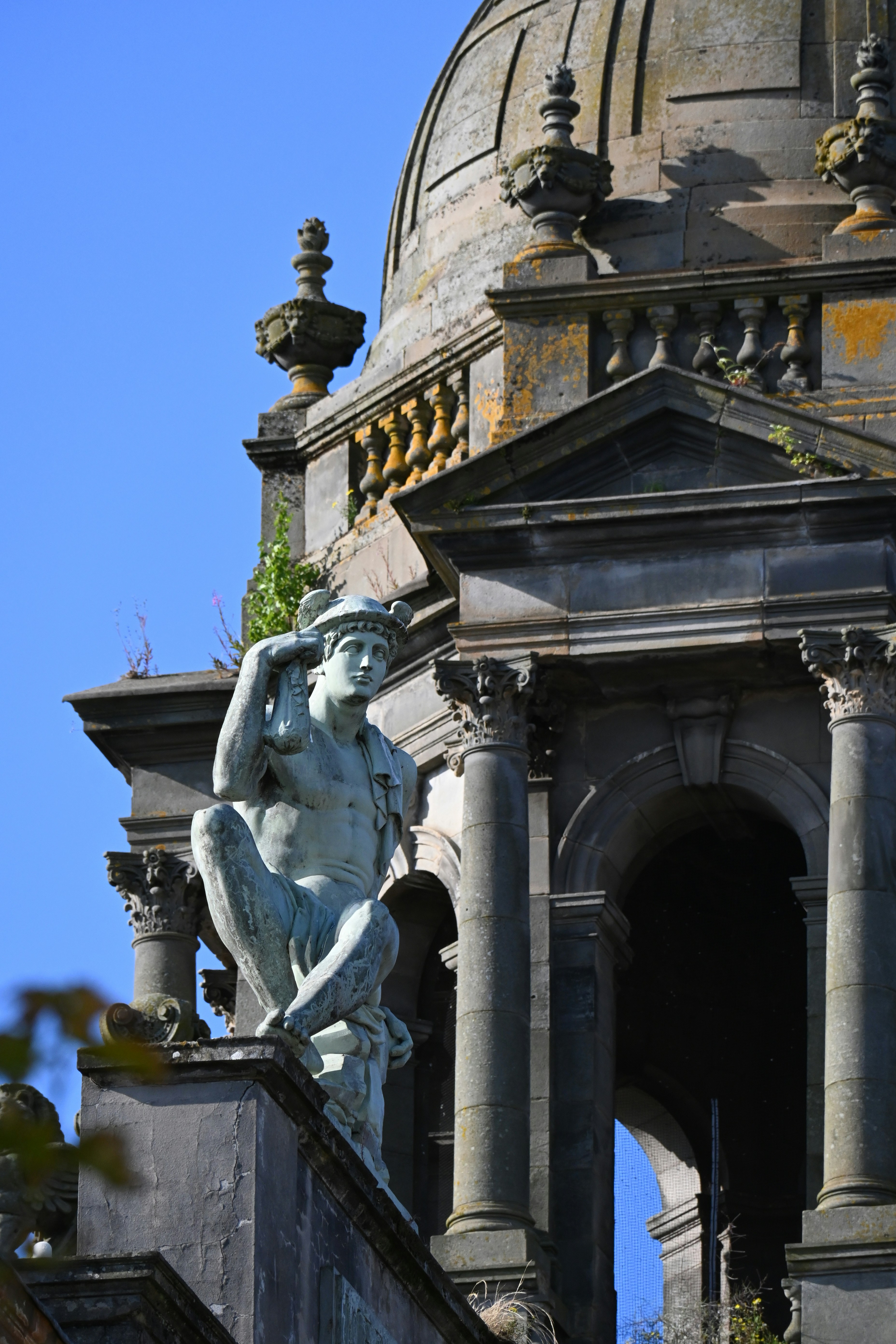 Bronze Statue and Ornate Facade: Echoes of Garden Architecture