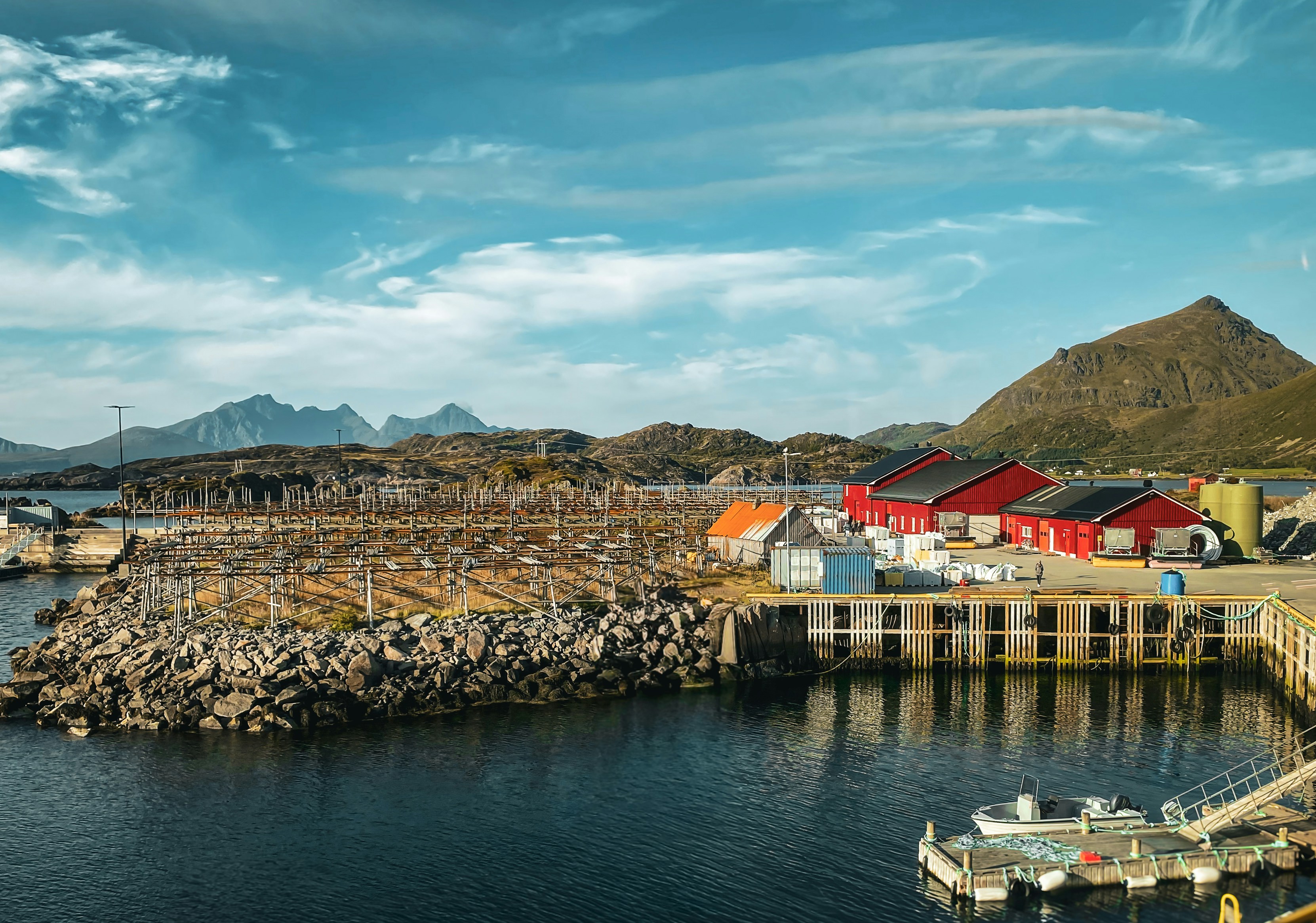 Coastal Rookery: Red Docks and Rocky Breakwater