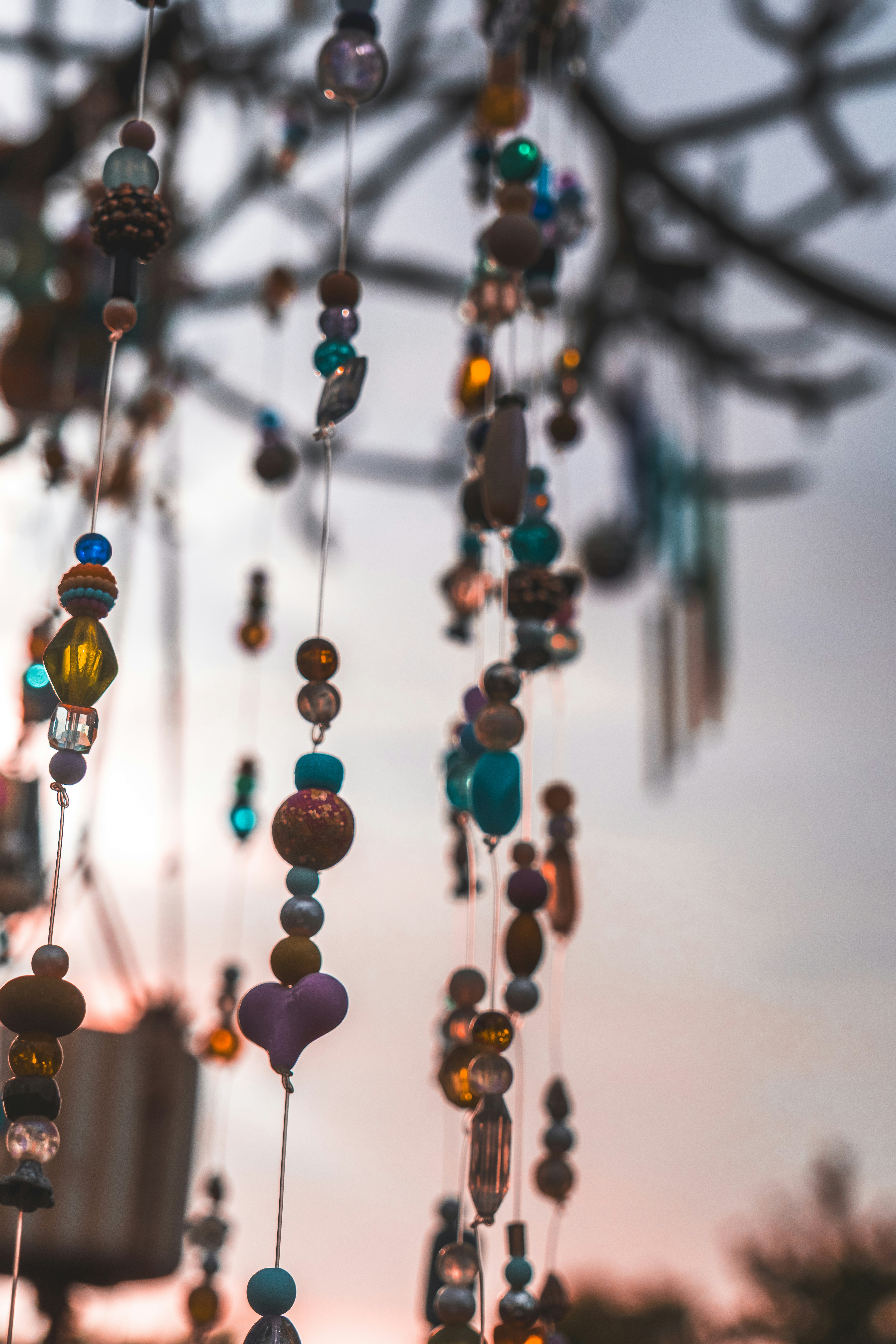 Beaded strings in soft sunset blur