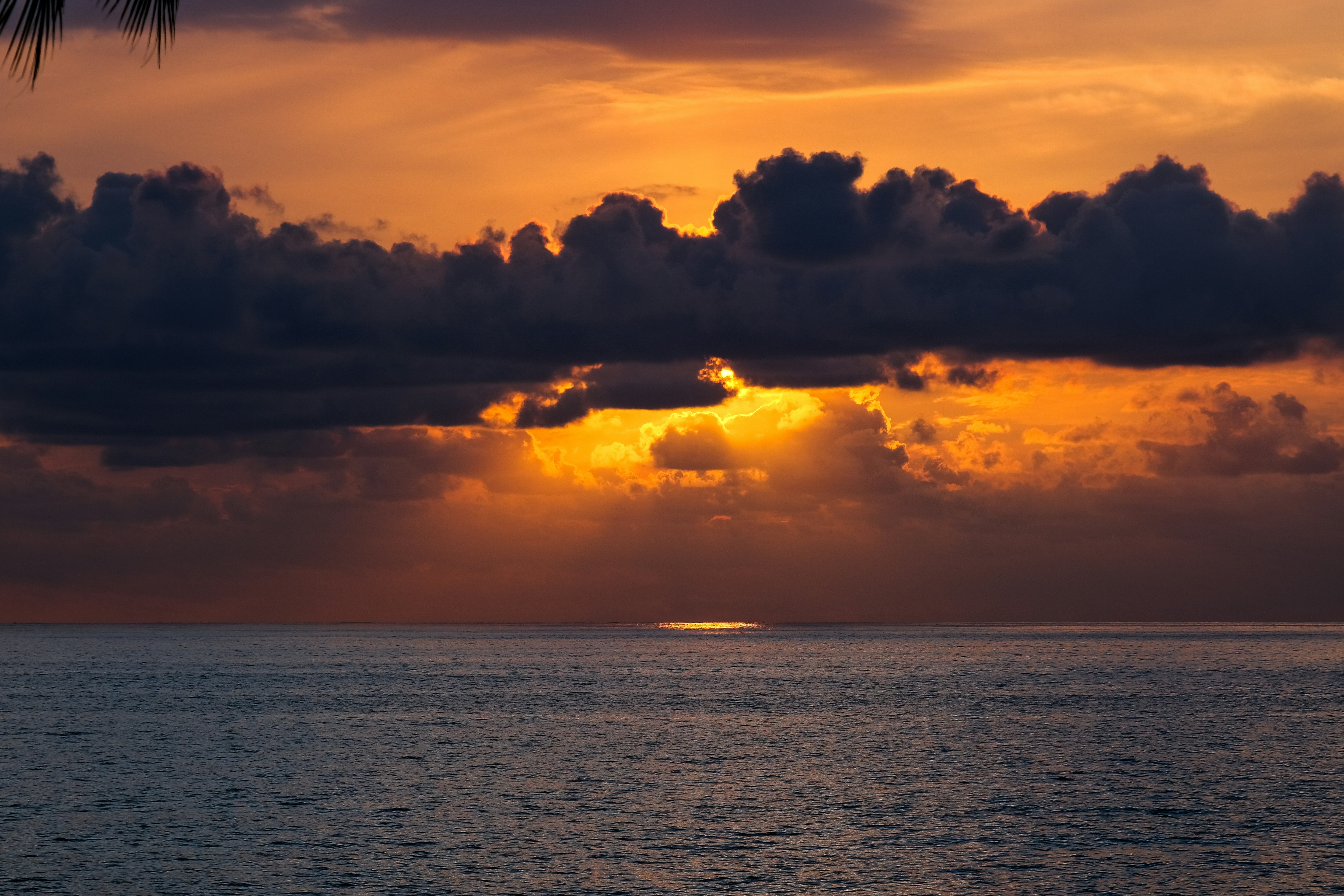 Sunset Gap: The Quiet Brilliance Over a Tranquil Sea