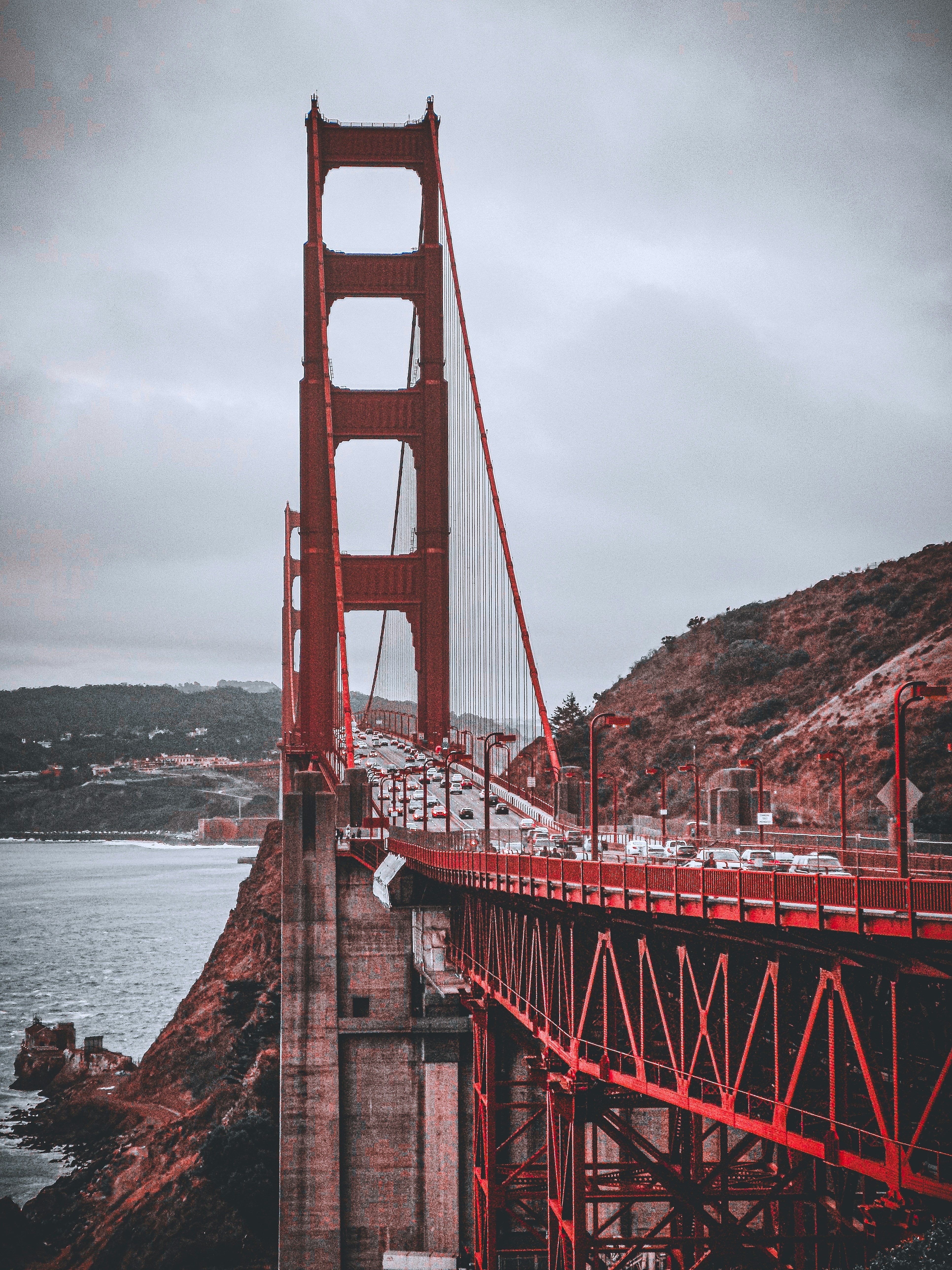 Red Span: The Golden Gate Bridge Crossing Over Silvery Mist