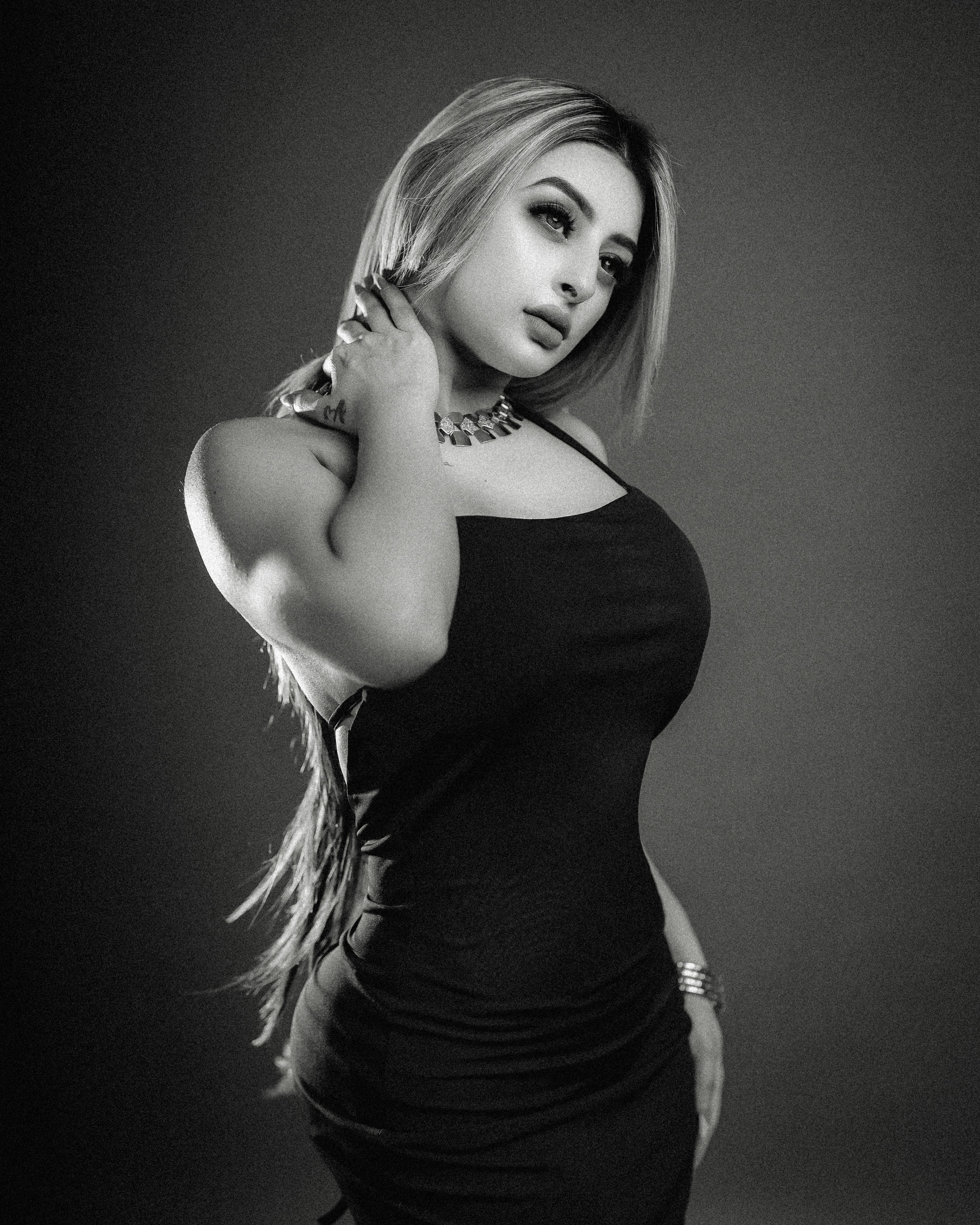 Silhouette of Confidence: A Black-and-White Portrait in Bodice and Long Hair