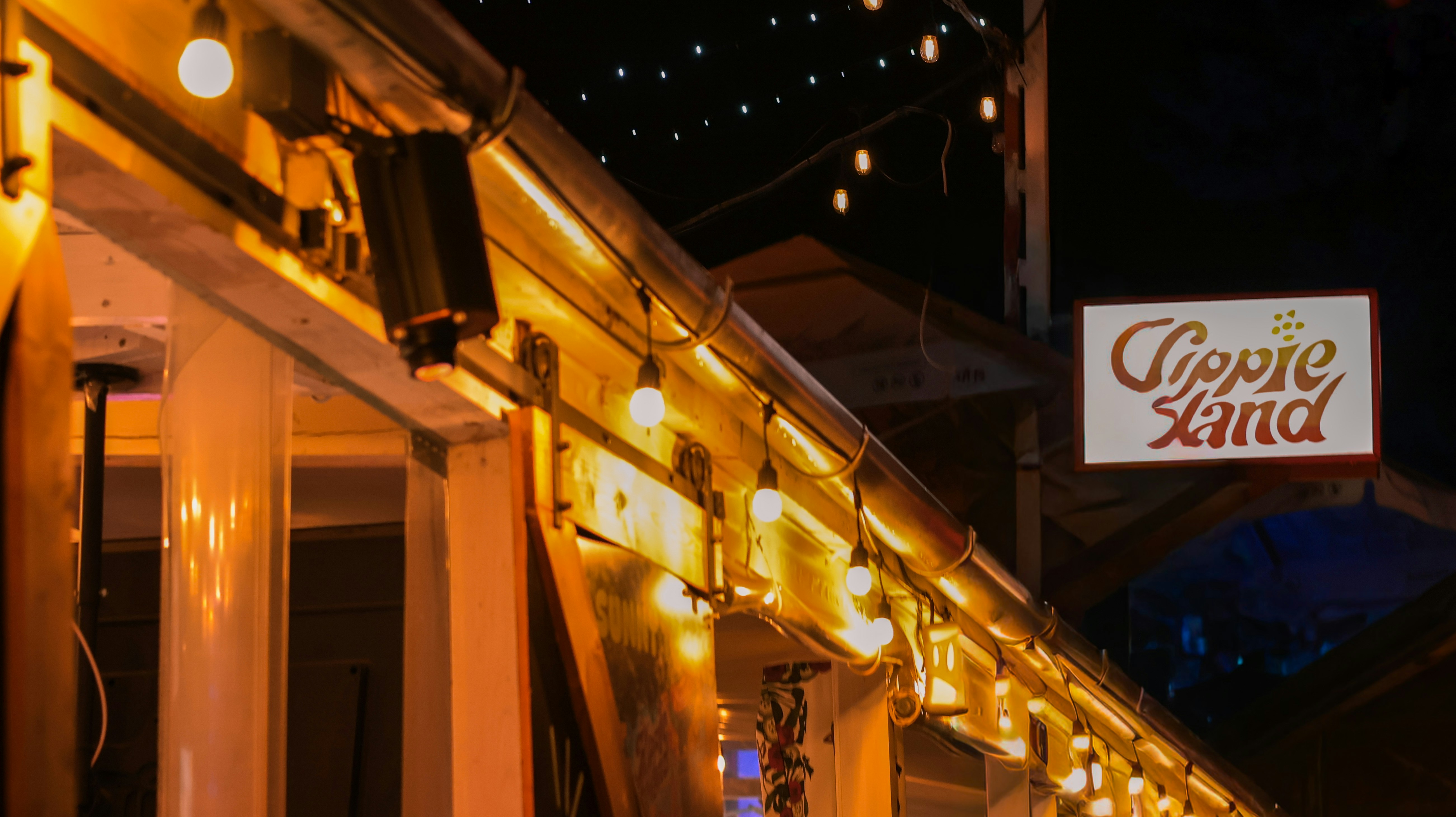 Warm Glow at the Night Market Sign