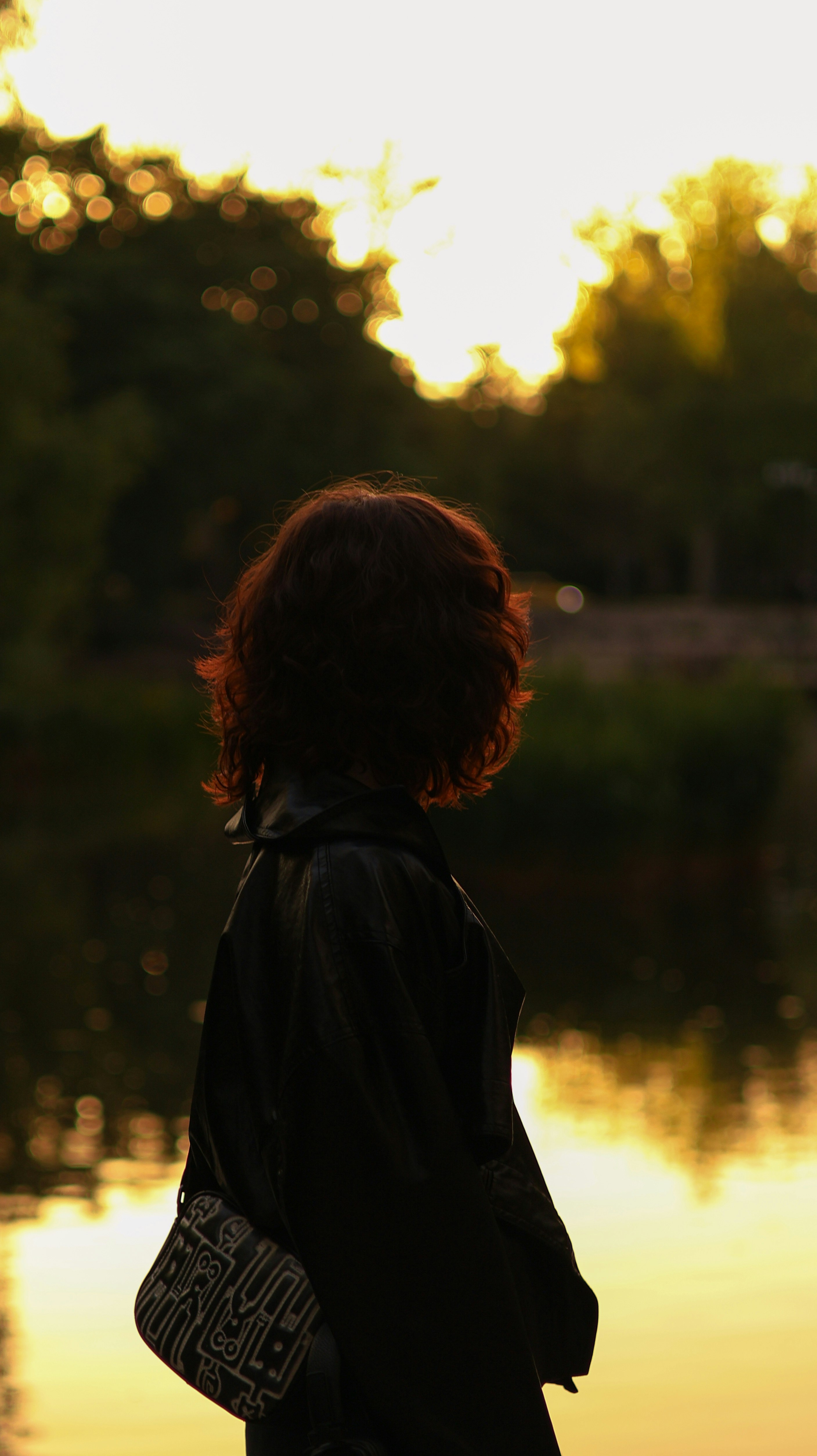 Backlit Silhouette by the Riverside