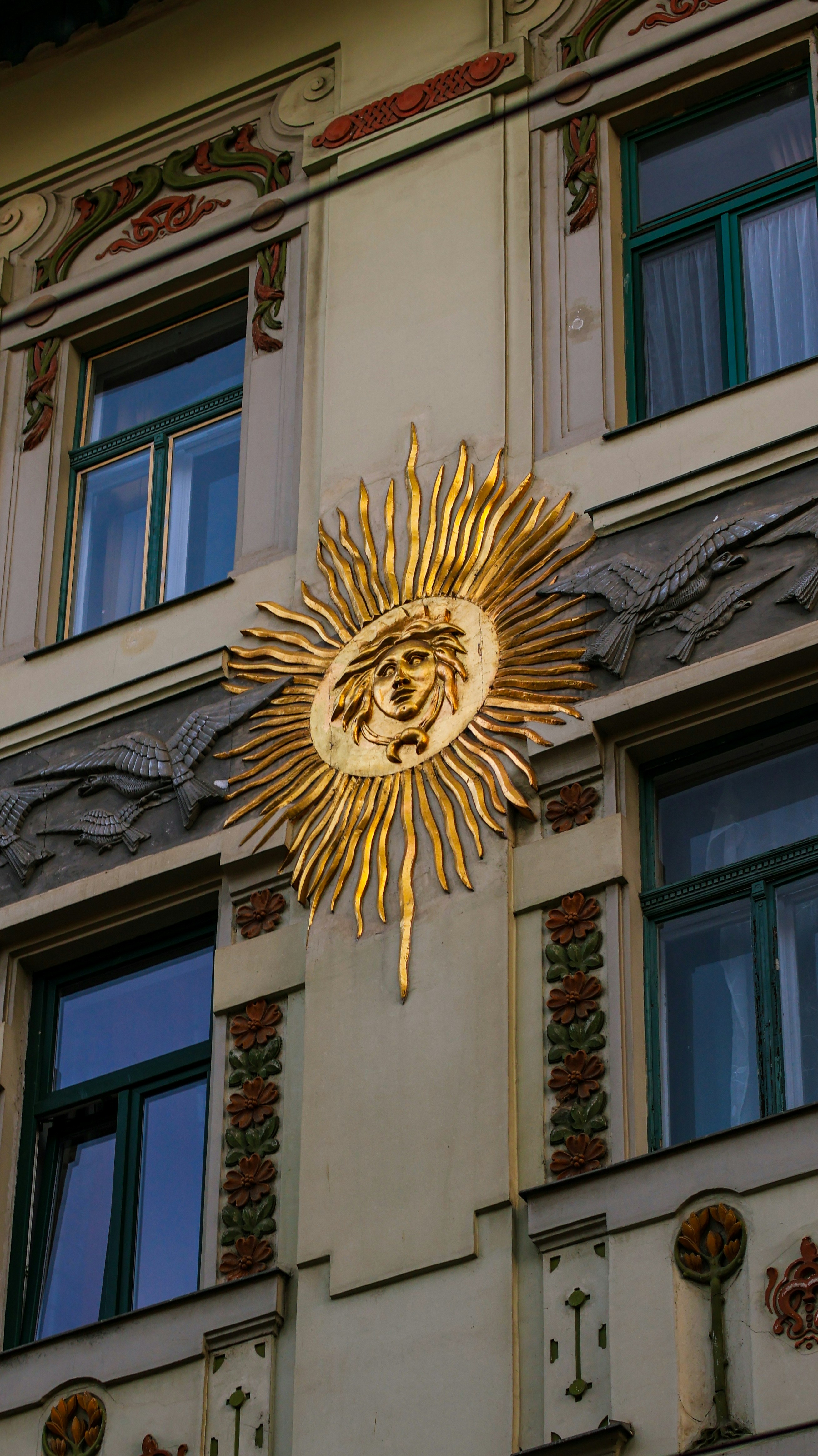Golden Sunburst Over a Historic Facade