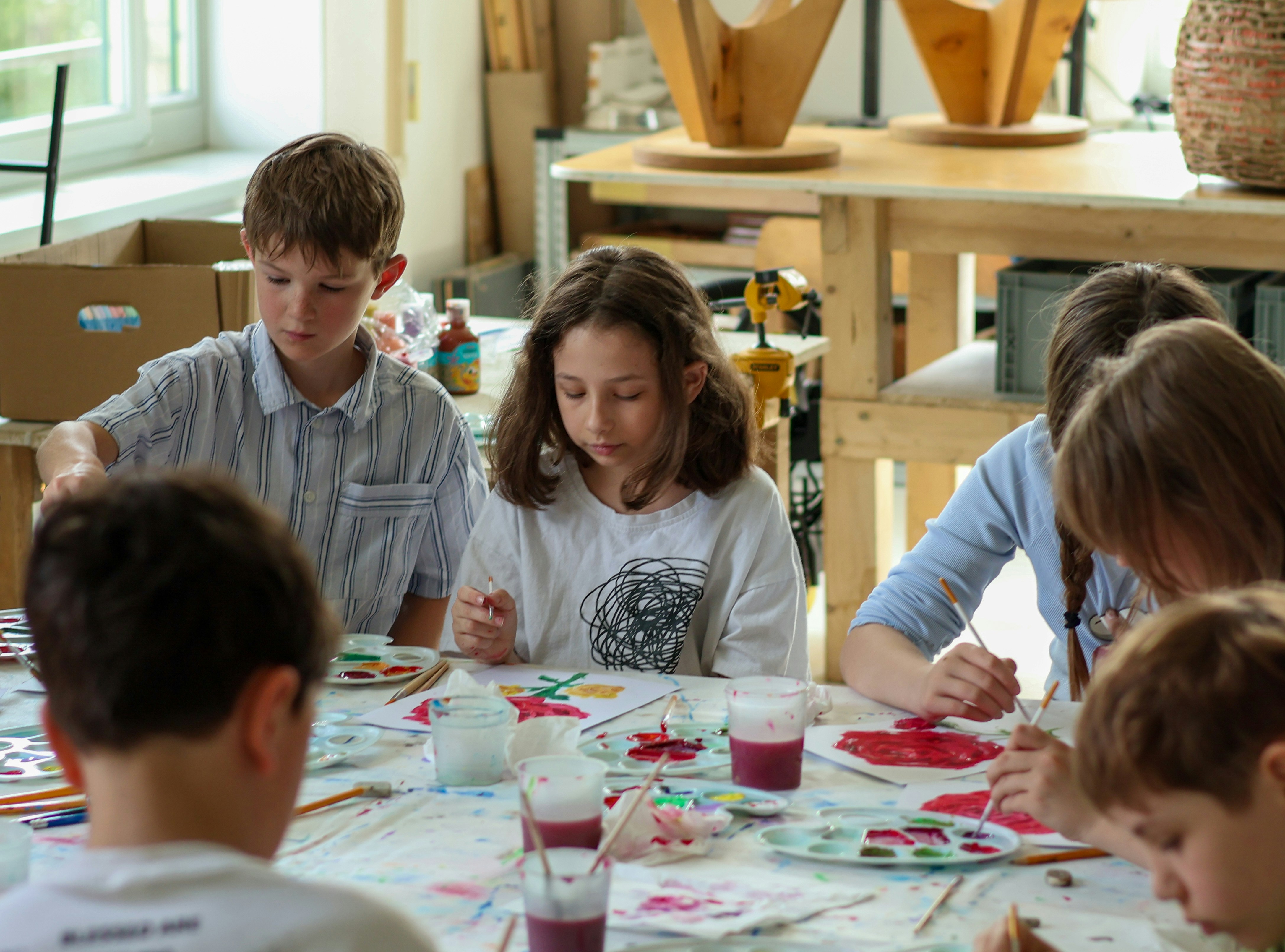 Youth Studio: Focused Moments Over a Painted Table